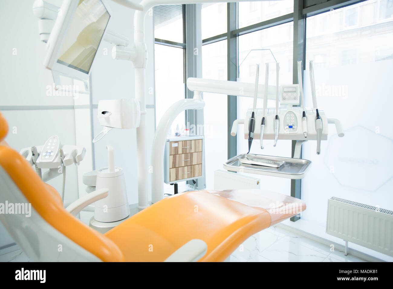 Contemporary equipment for dental check-up with armchair for patient ...
