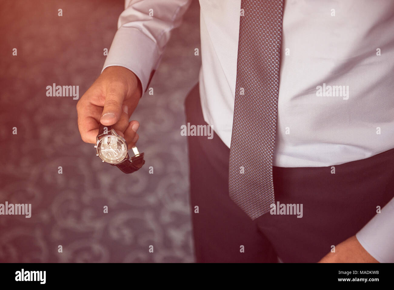 Businessman watching wrist watch hi-res stock photography and images ...