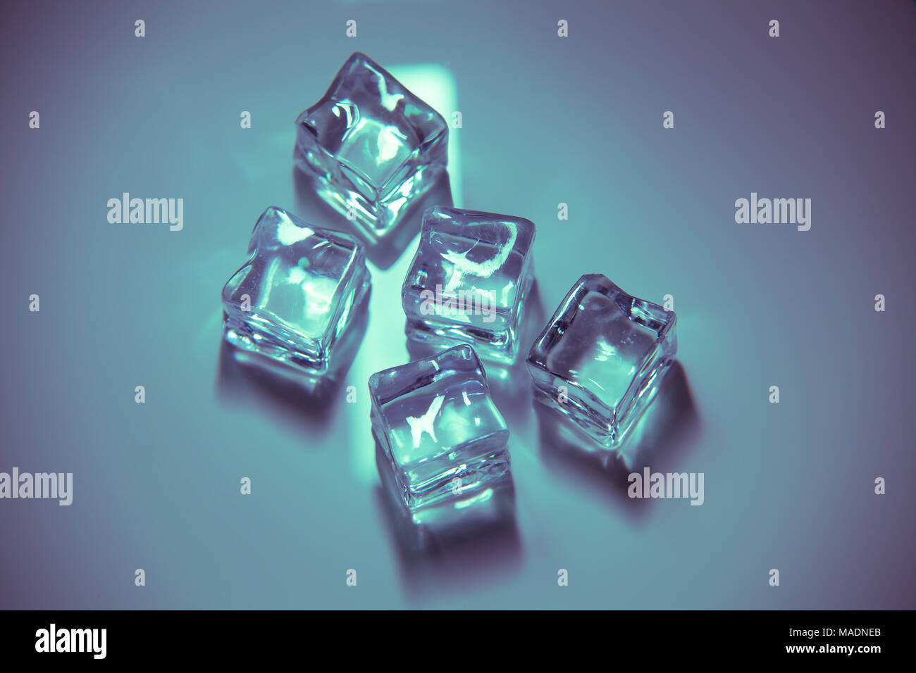 Five Ice Cubes Colored, on neutral background Stock Photo - Alamy
