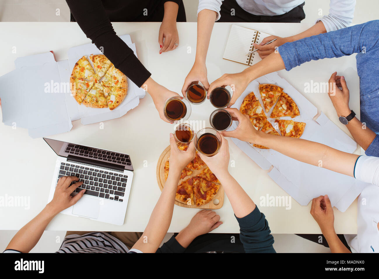 Lunch and people concept. Happy business team eating pizza in office ...