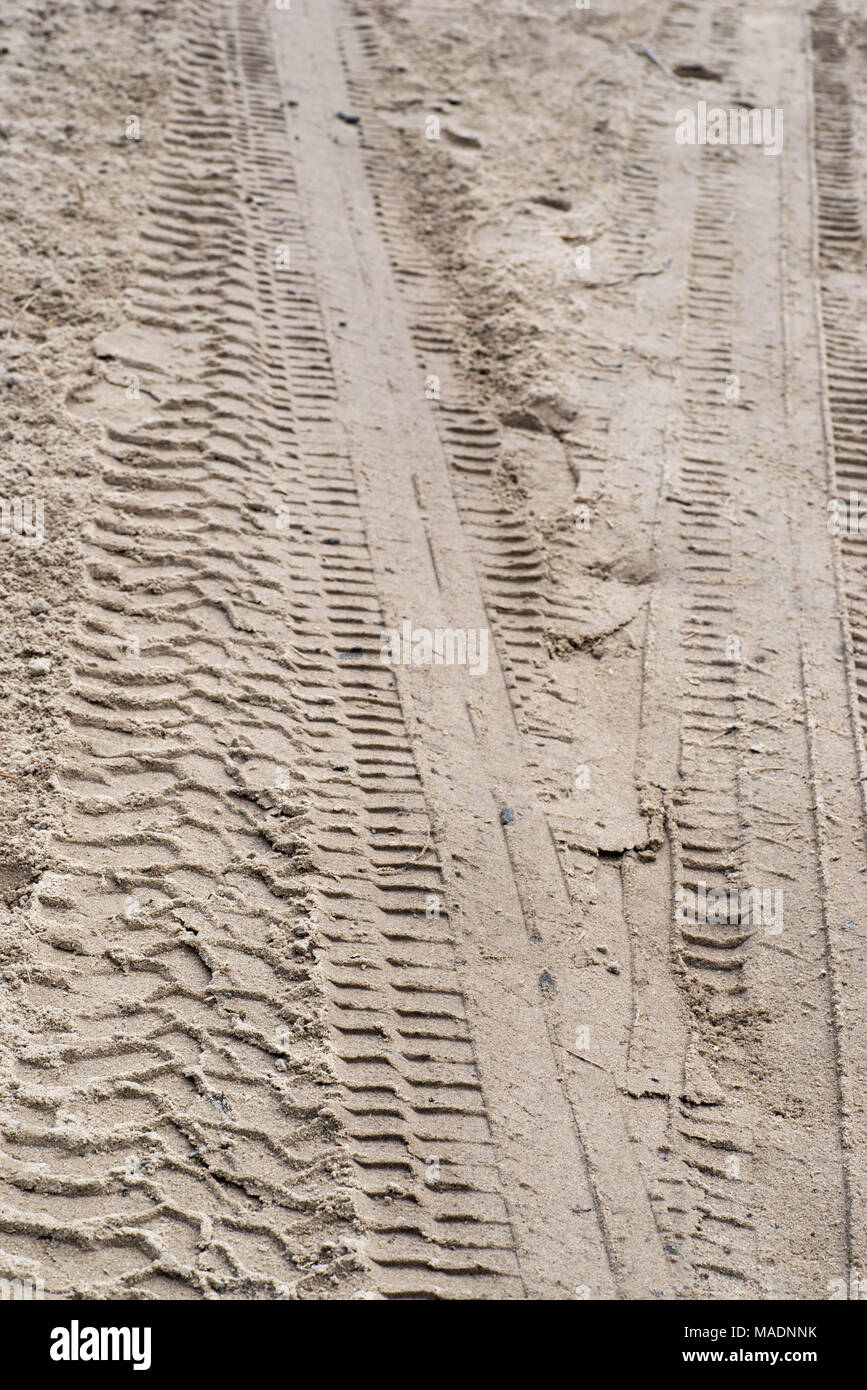 tire tracks truck on a dirt road background Stock Photo - Alamy