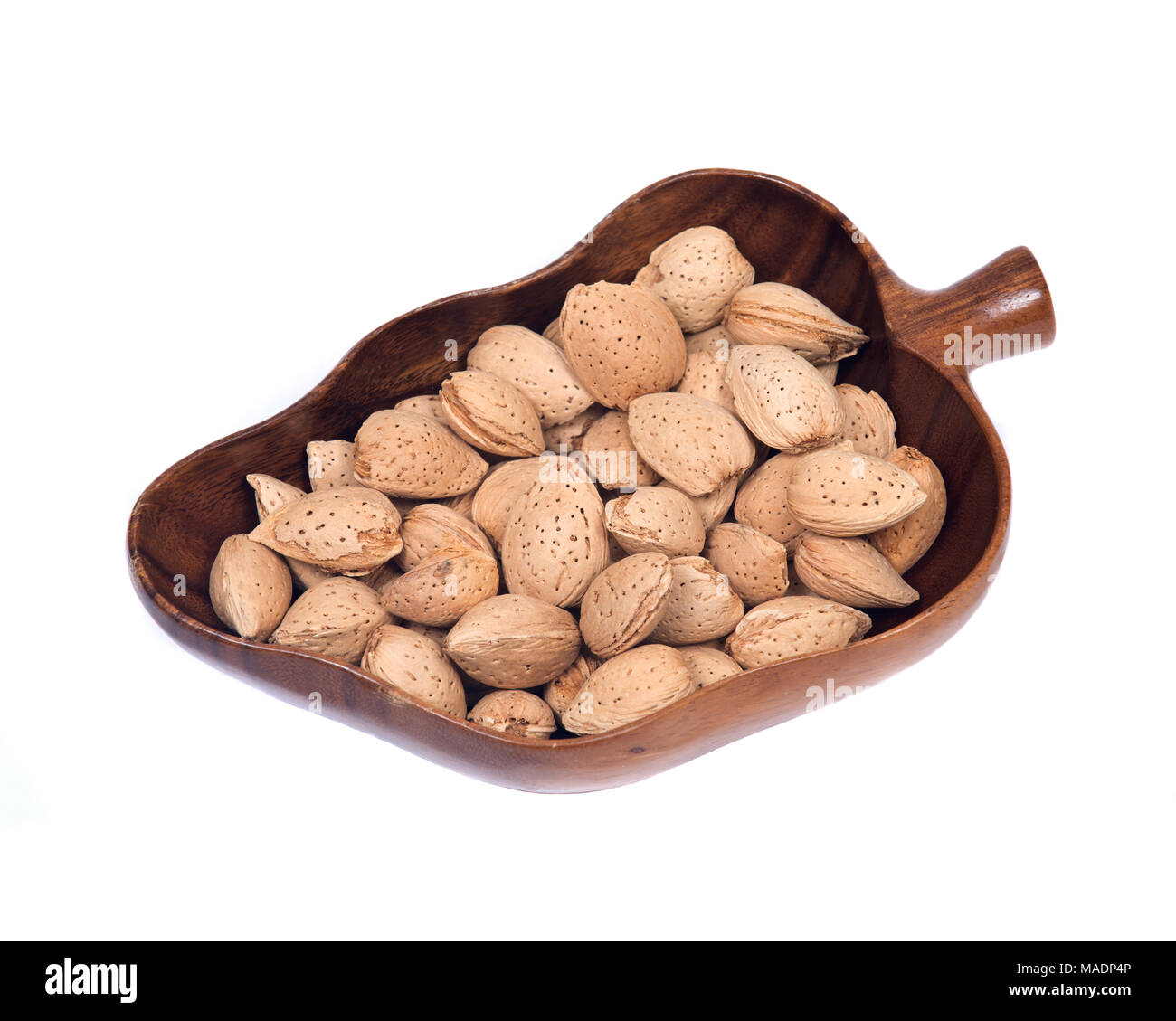 Raw almonds in shell in wooden vintage bowl isolated on white ...