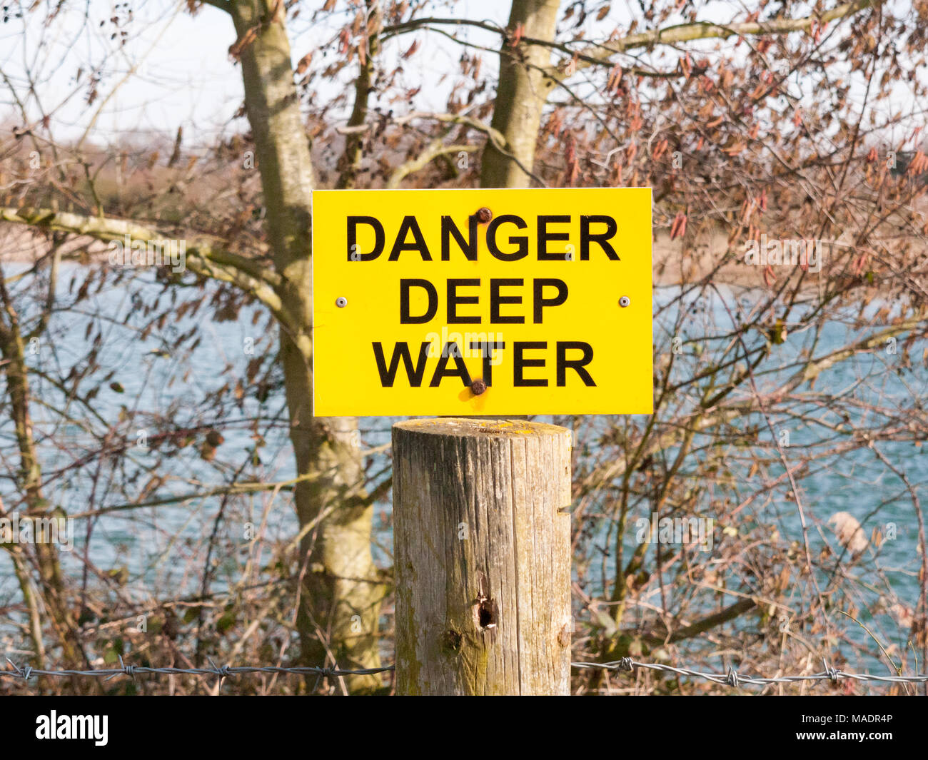 yellow and black sign danger deep water lake; essex; england; uk Stock ...