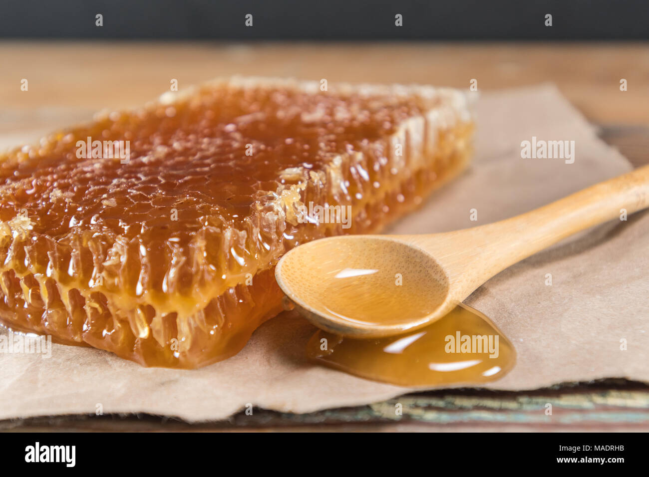 Honey Spills from Wooden Spoon Stock Photo - Alamy