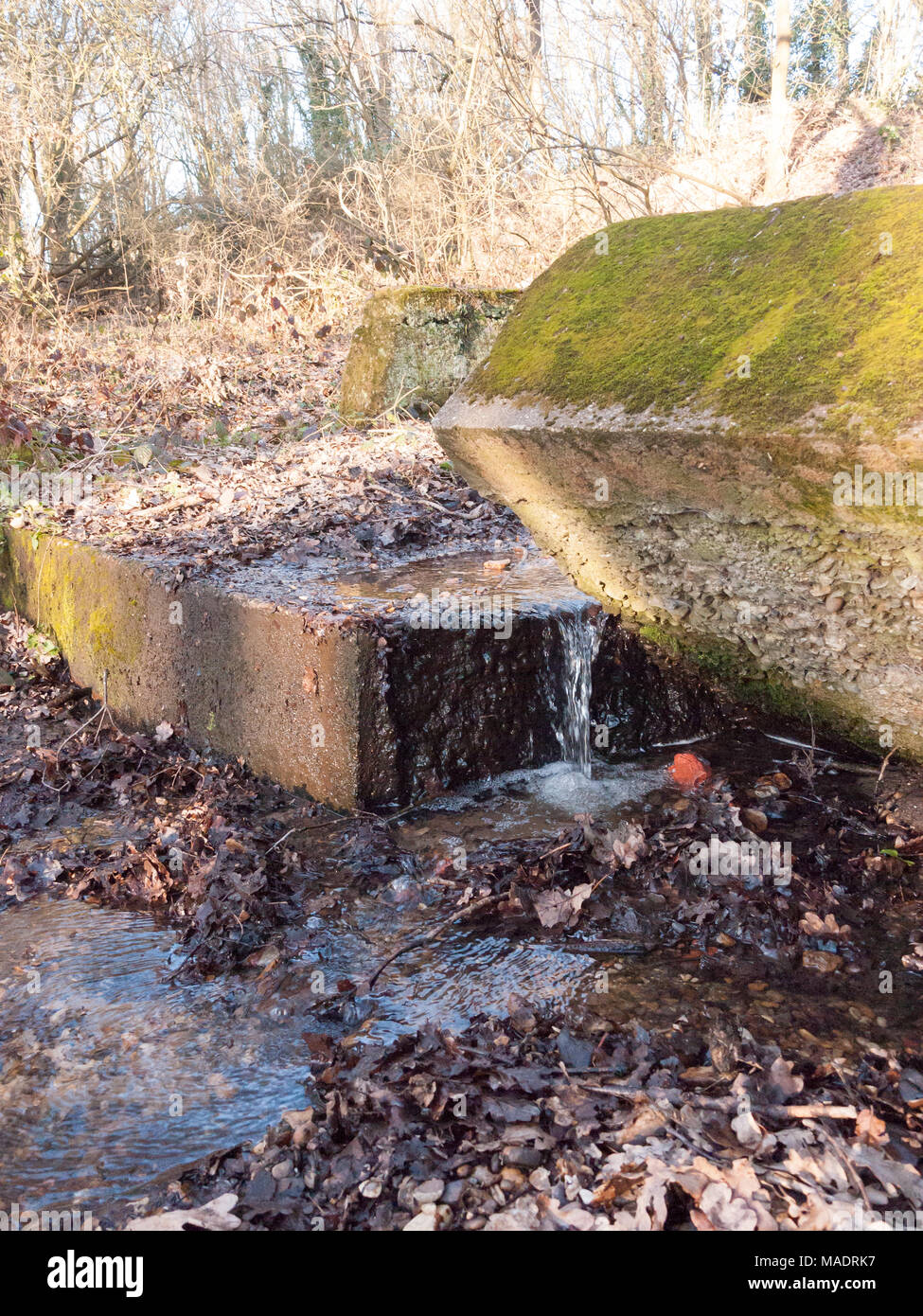 running creak of water over rocks splashing down ; essex; england; uk ...