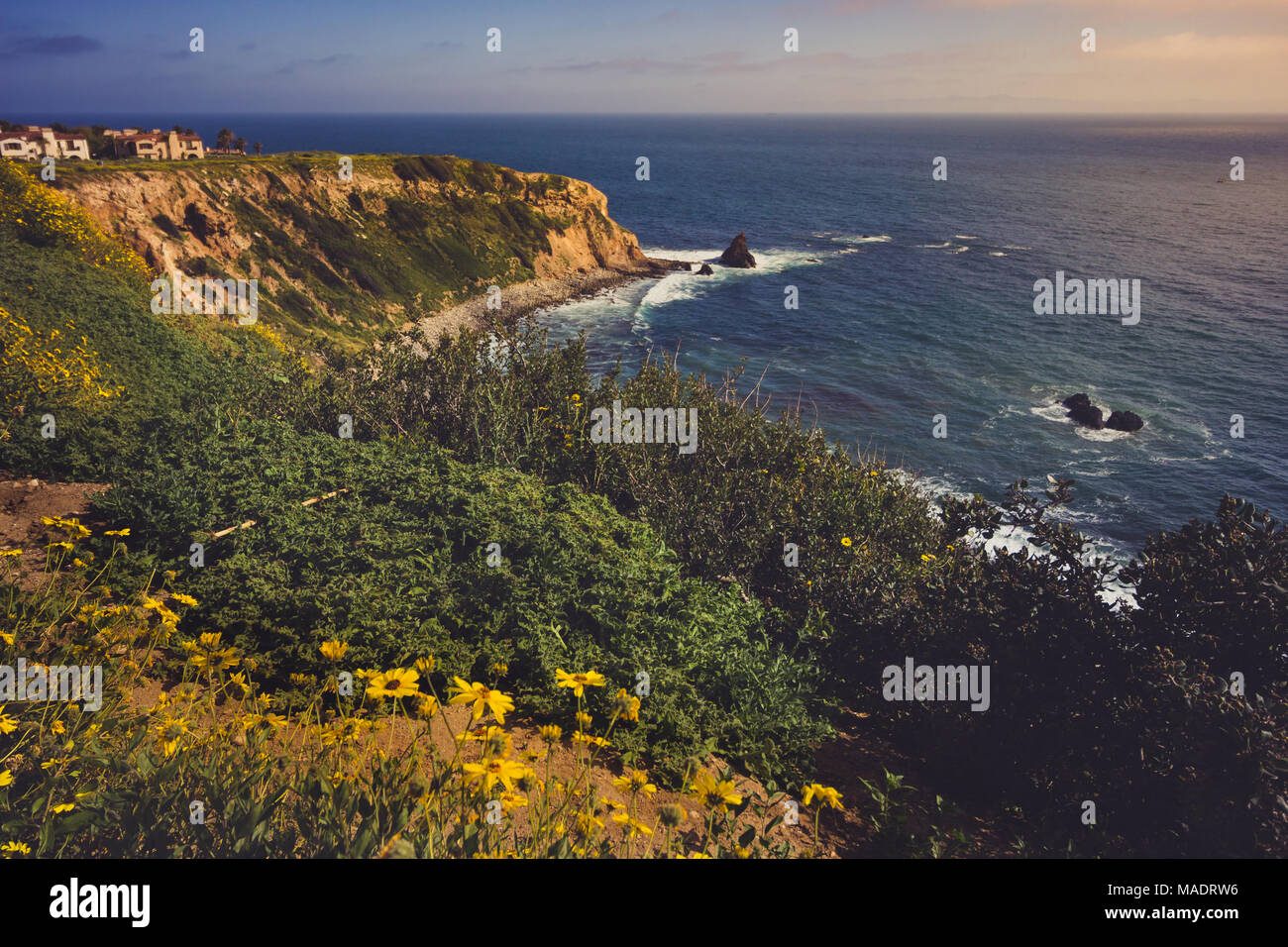Colorful coastal view of the dramatic Pelican Cove cliffs covered with ...