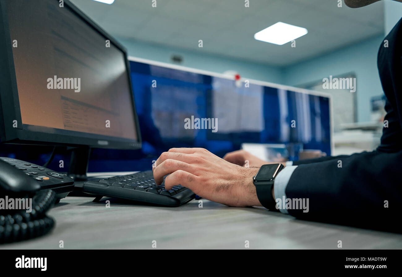 man working at a computer in the office Stock Photo - Alamy
