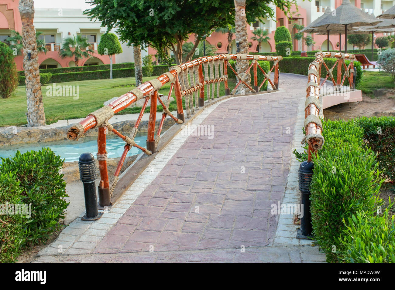 Stone bridge railing with bamboo over a stream Stock Photo - Alamy