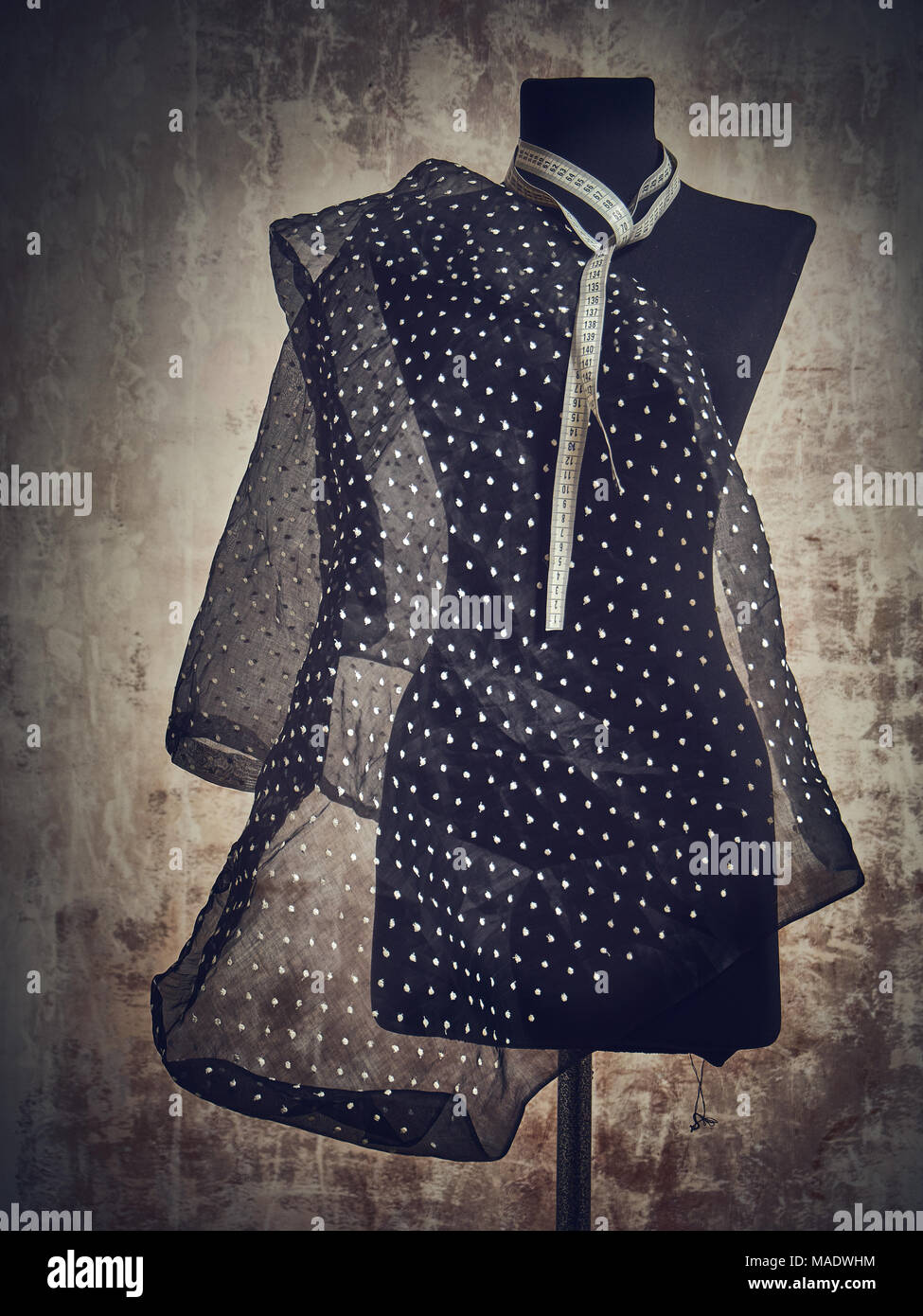 A dummy for fitting and convenience of tailoring, on the neck of which ...