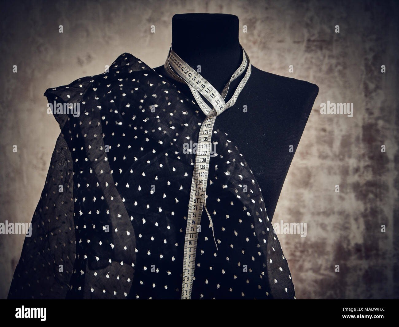 A dummy for fitting and convenience of tailoring, on the neck of which ...