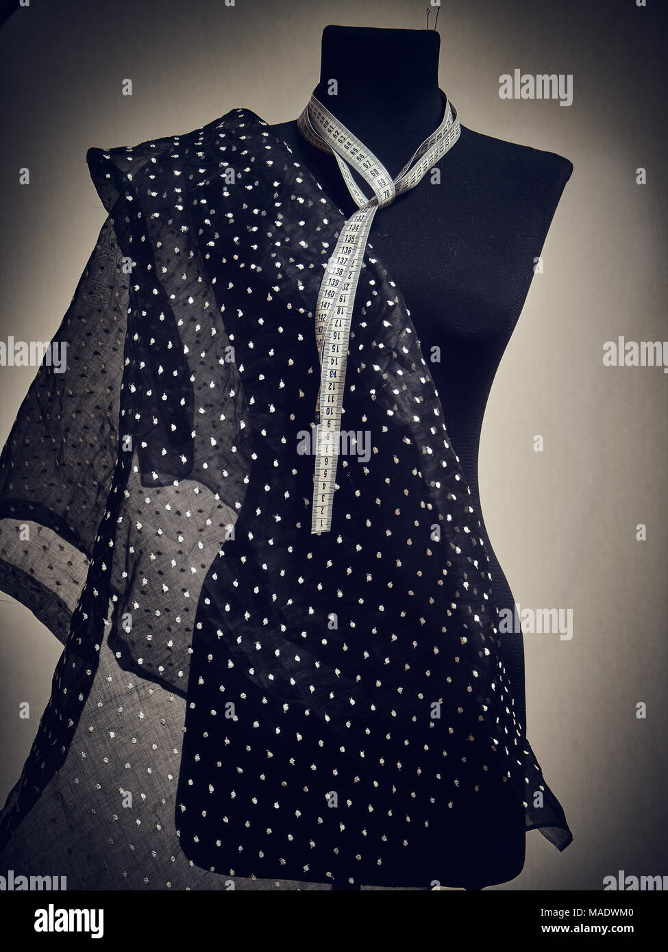 A dummy for fitting and convenience of tailoring, on the neck of which ...