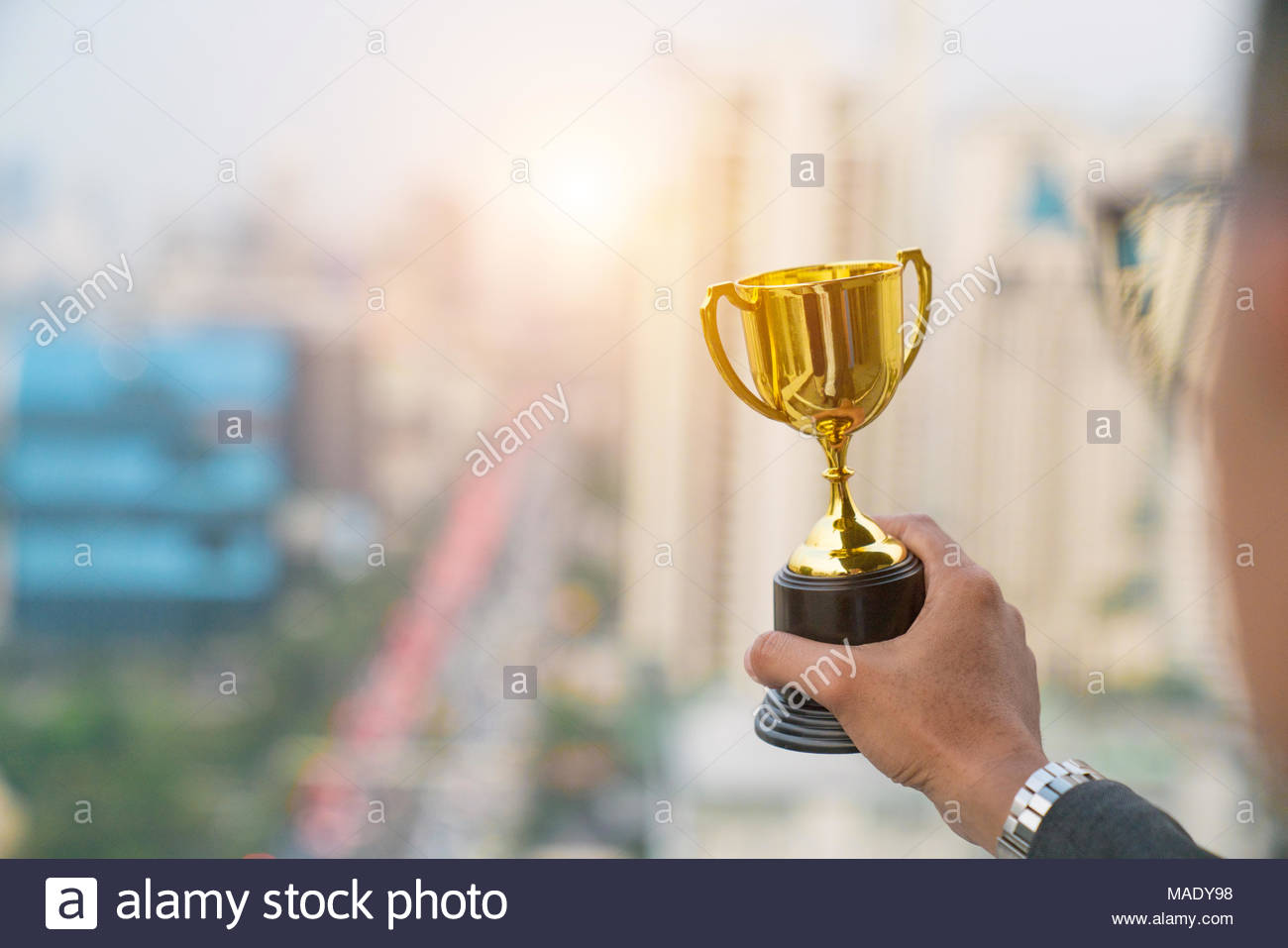 Man Holding Trophy Cup Stock Photos & Man Holding Trophy Cup Stock ...