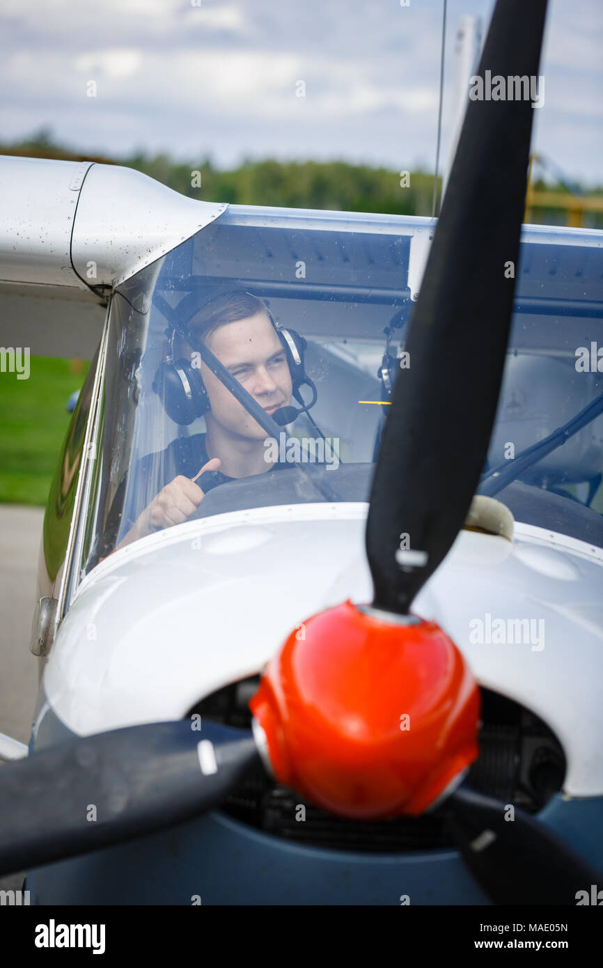 young man in small plane cockpit Stock Photo - Alamy