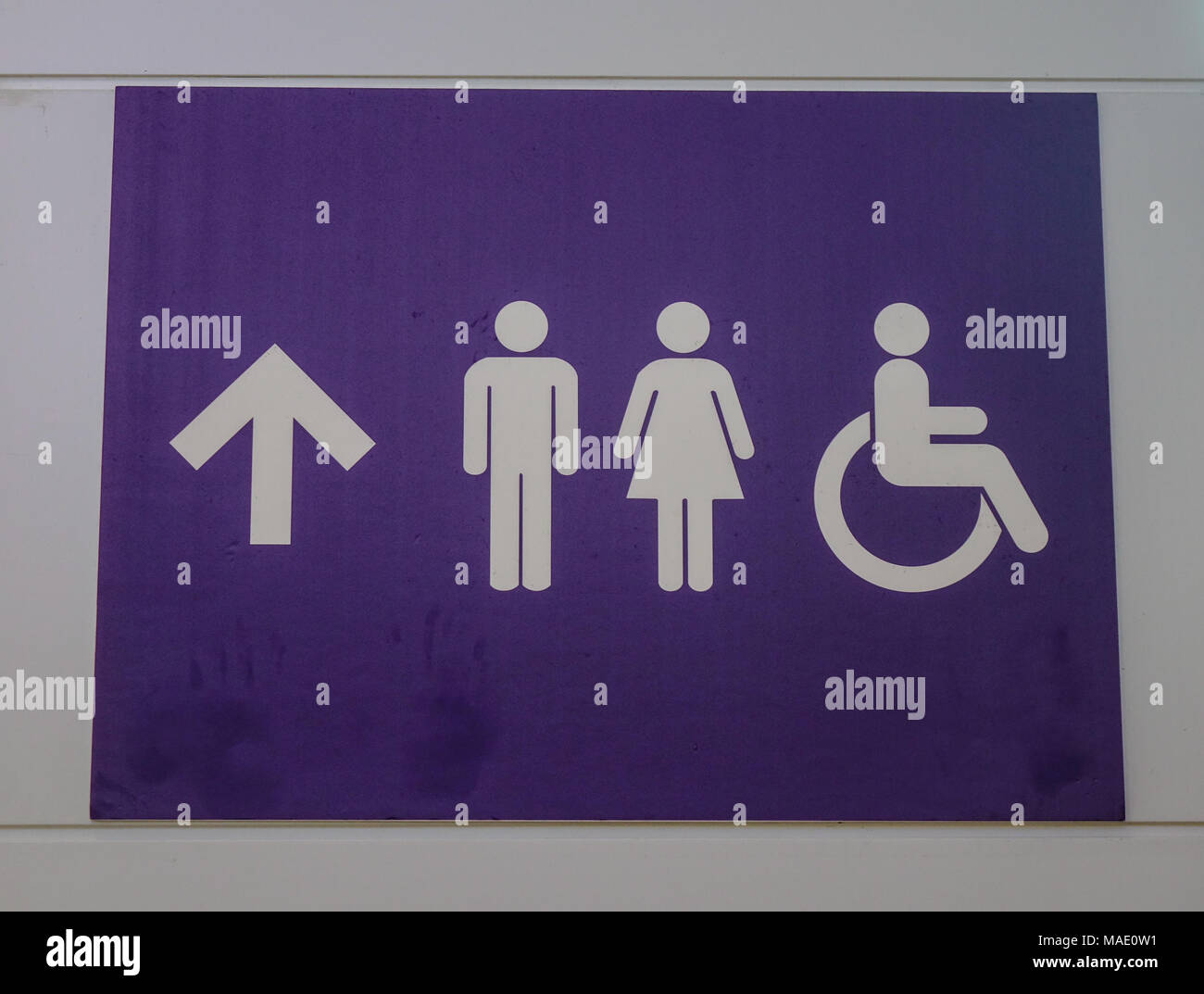 Public restroom signs with a disabled access symbol Stock Photo - Alamy