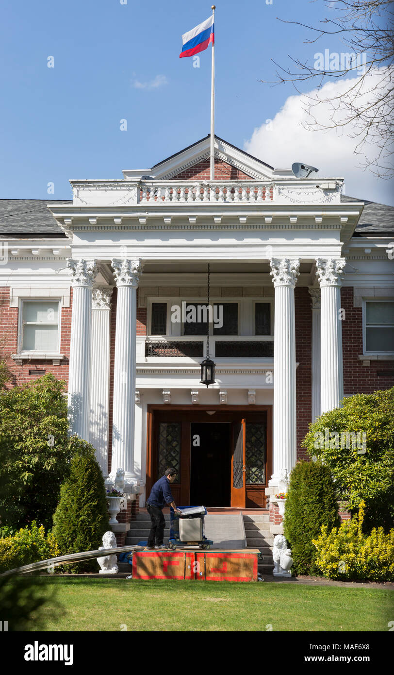 Seattle, Washington: A mover hauls furniture into the front entrance of ...