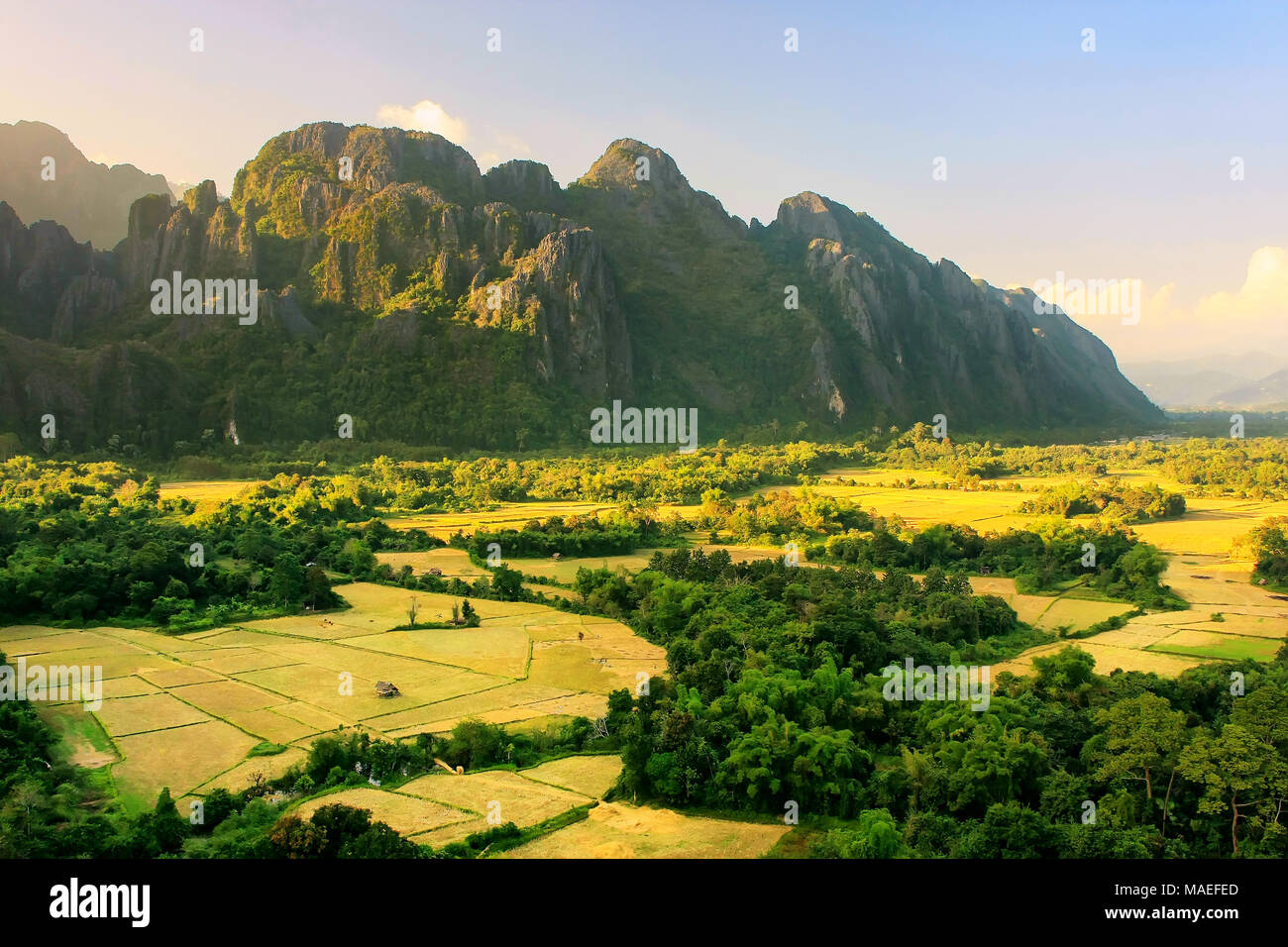 Aerial view of farm fields and rock formations in Vang Vieng, Laos ...