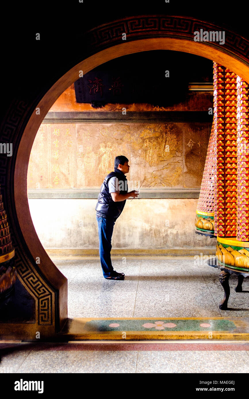 Man Praying one of many Dao God's in a Taiwanese Dao Temple Stock Photo ...