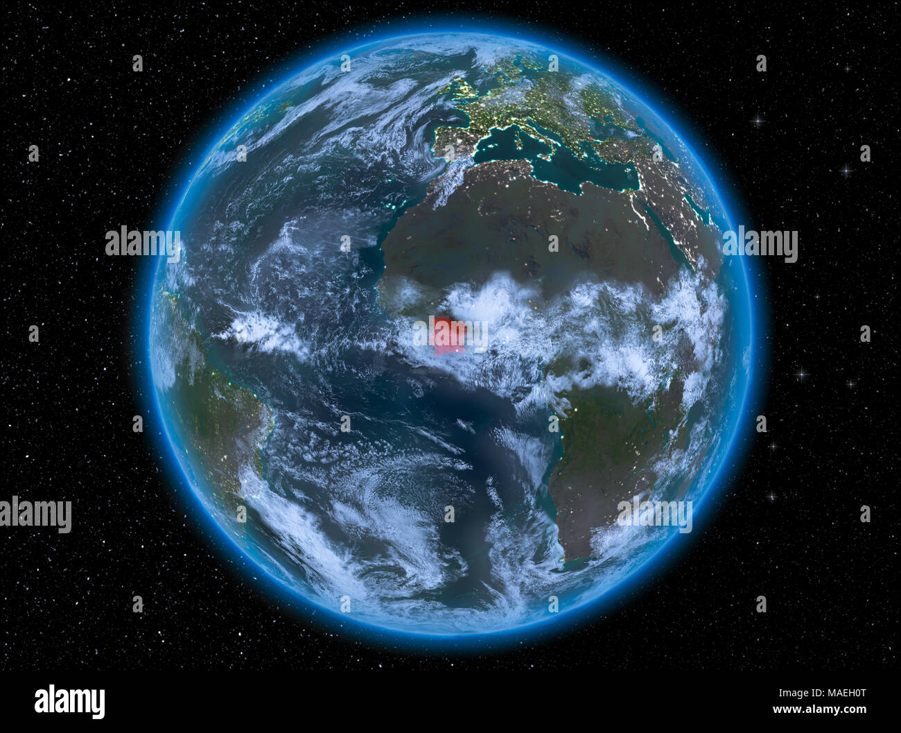 Night view of Ivory Coast highlighted in red on planet Earth with ...