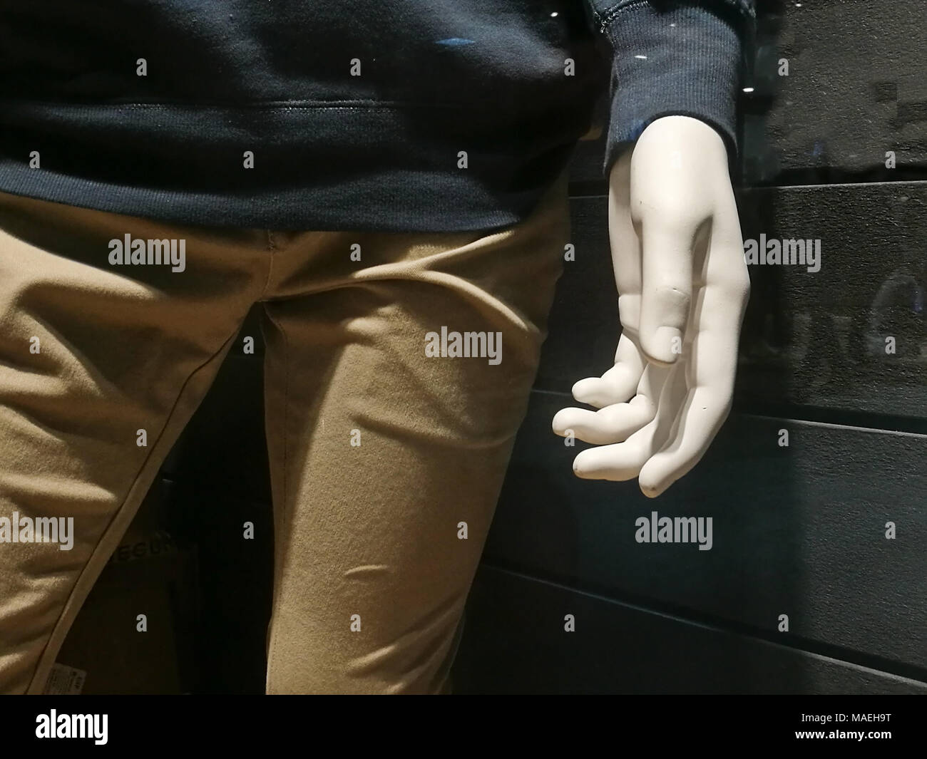 Left hand ready to shake from cloth model standing Stock Photo - Alamy