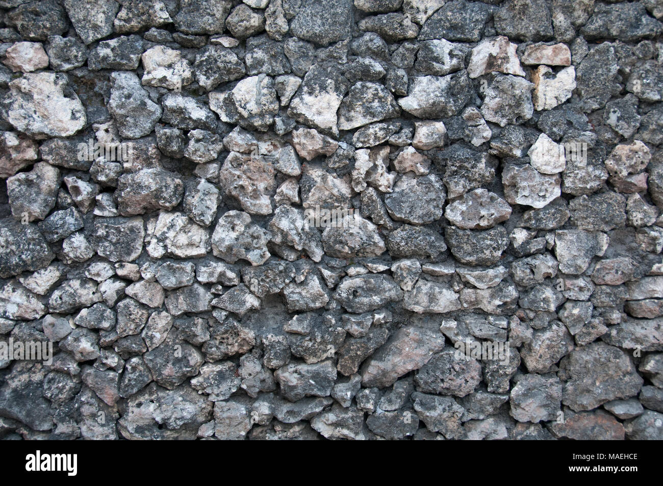 Big rough rocks wall background Stock Photo - Alamy