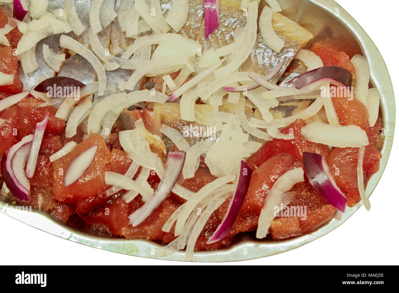 Herring, cut into pieces, sprinkle with onions Stock Photo - Alamy