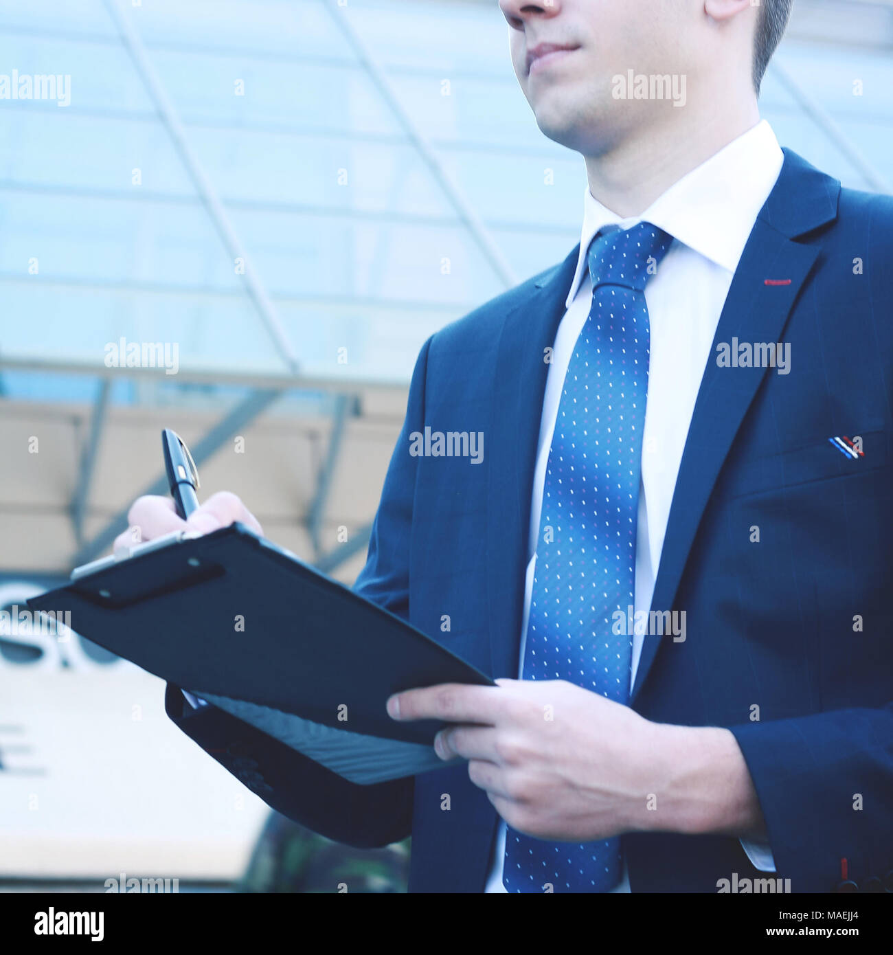 Businessman signing acceptance report contract, modern highrise Stock ...