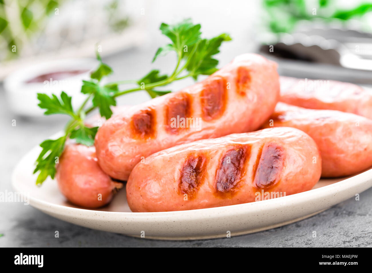 Grilled sausages on plate. BBQ sausages Stock Photo - Alamy