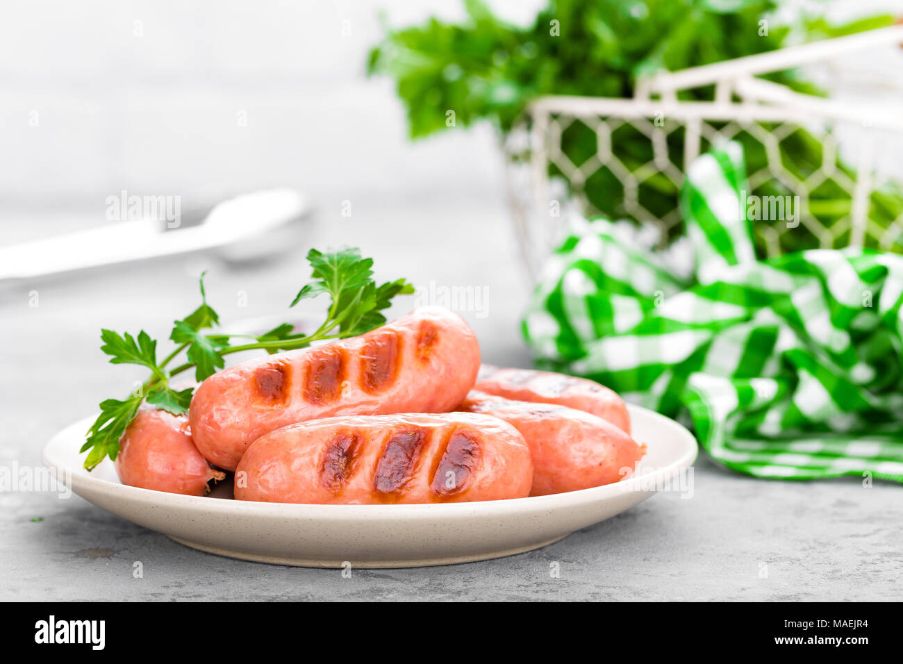 Grilled sausages on plate. BBQ sausages Stock Photo - Alamy