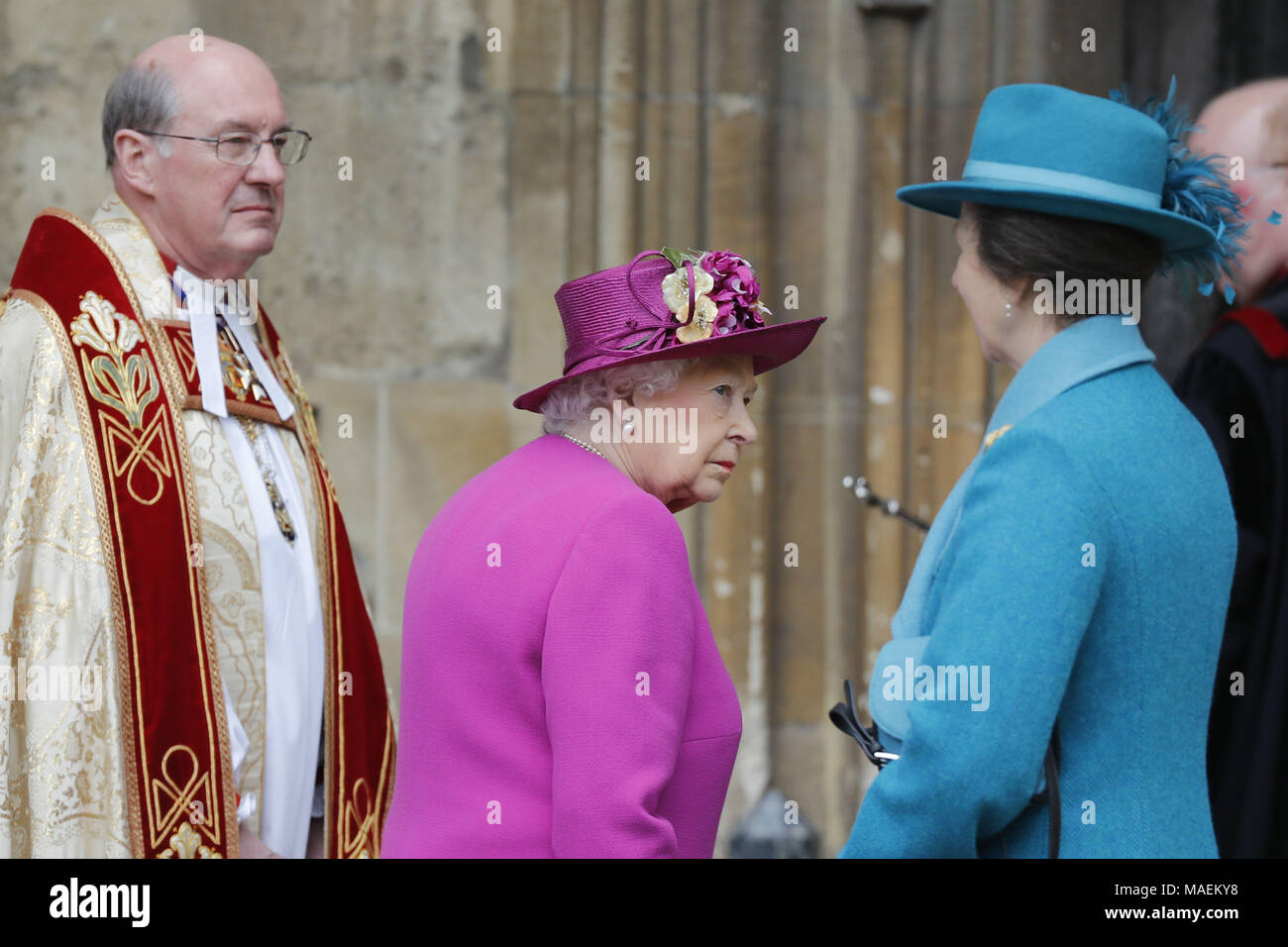 The Dean of Windsor David Conner watches as Queen Elizabeth II and the ...