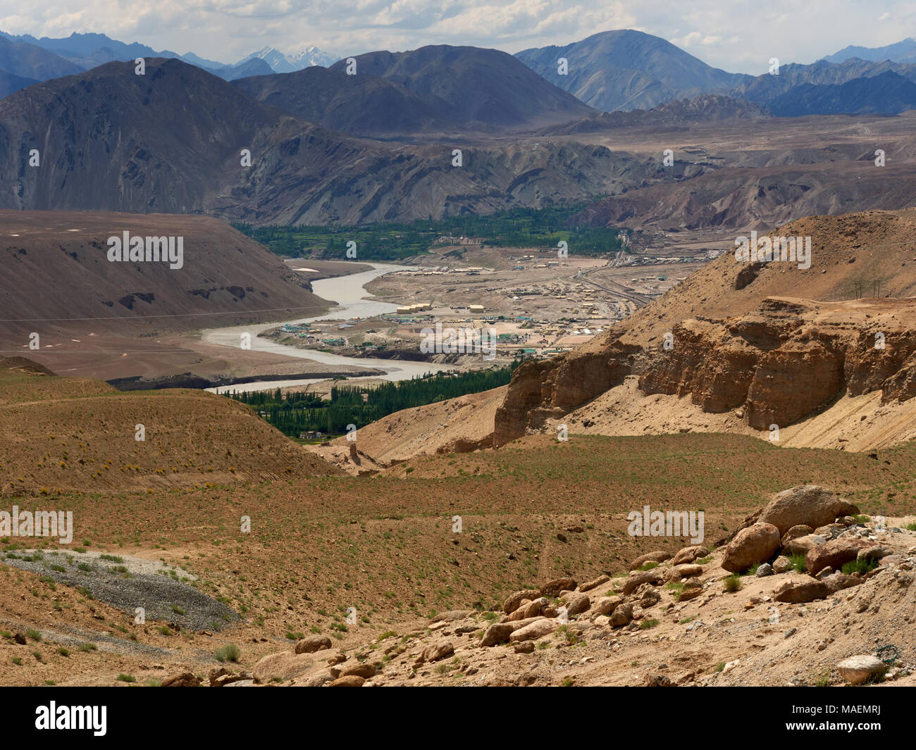 Mountain desert valley in the Himalayas: among the brown rocks there ...