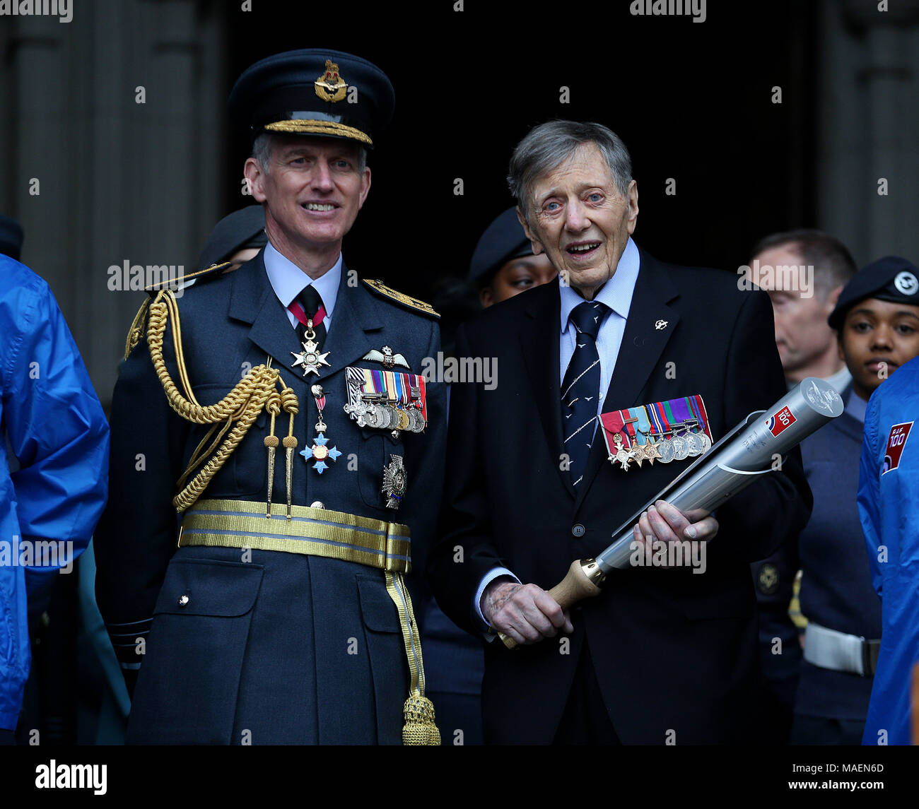 Royal Air Force veteran, Air Commodore Charles Clarke, carrying the ...