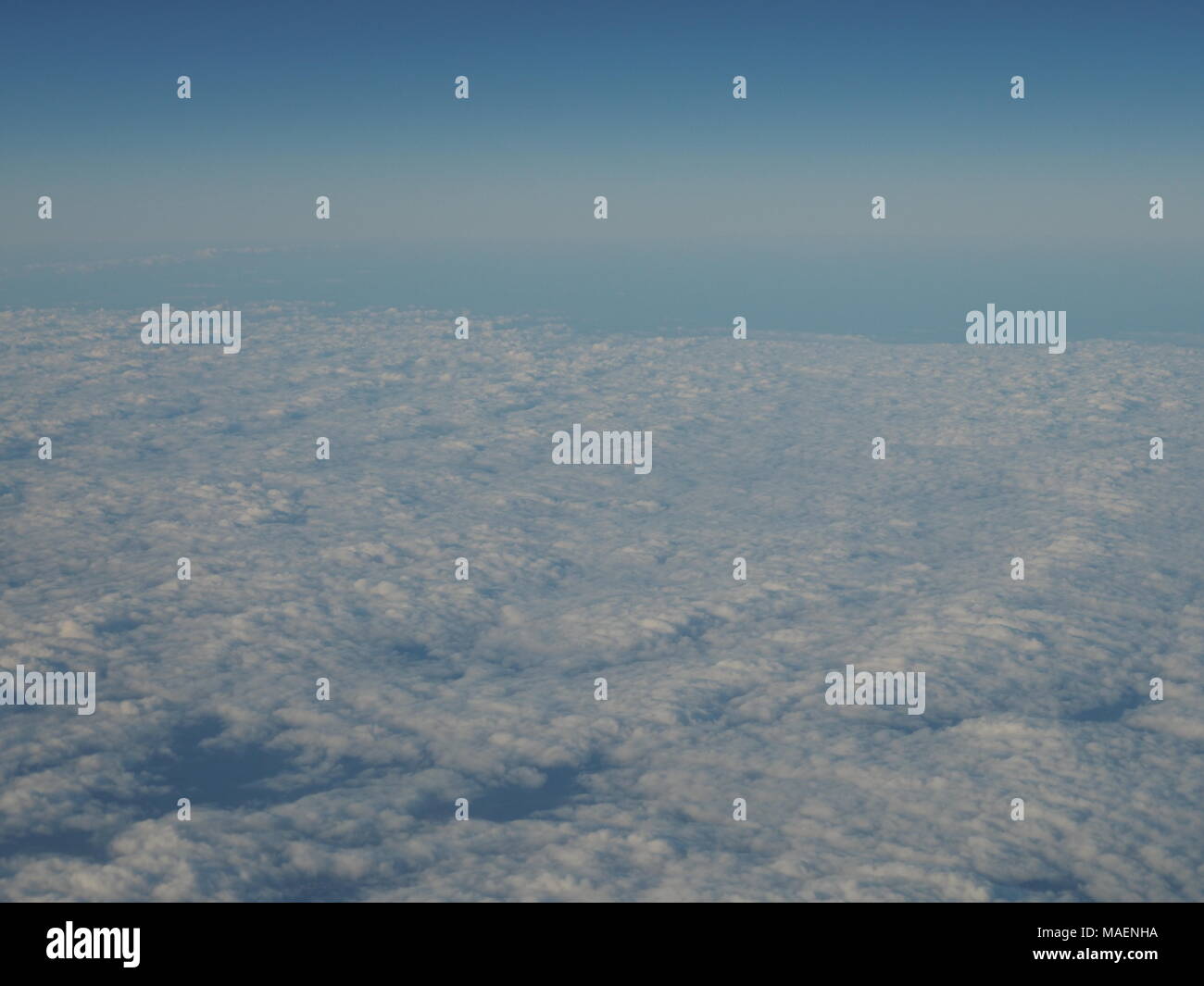 Panoramic view of scenic blue sky and cloud as seen through window of ...
