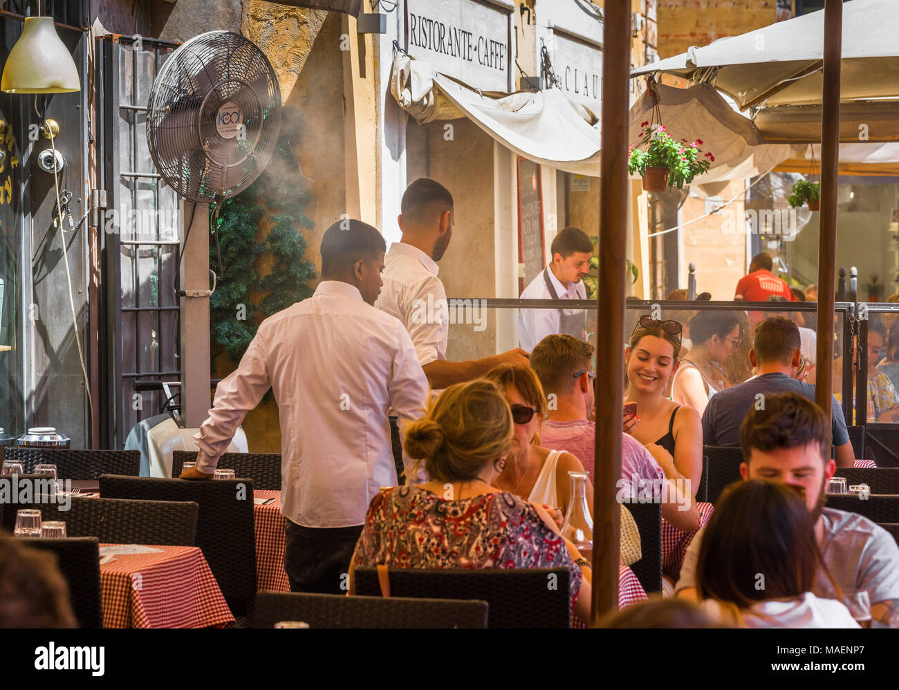 People in a street café on a hot summer day. Rome, Italy Stock Photo ...