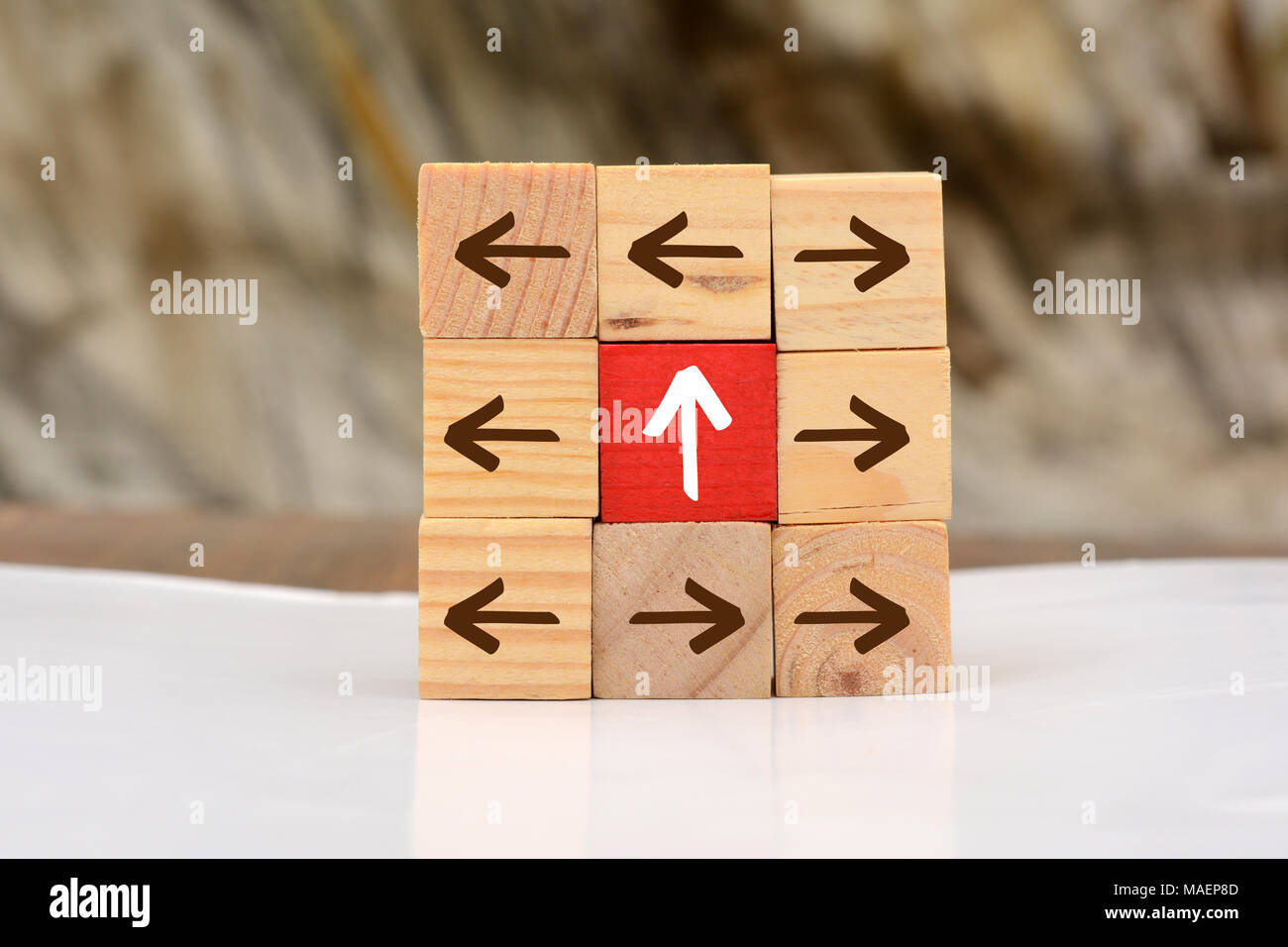 Growing Up concept with wood blocks arrow going upward Stock Photo - Alamy