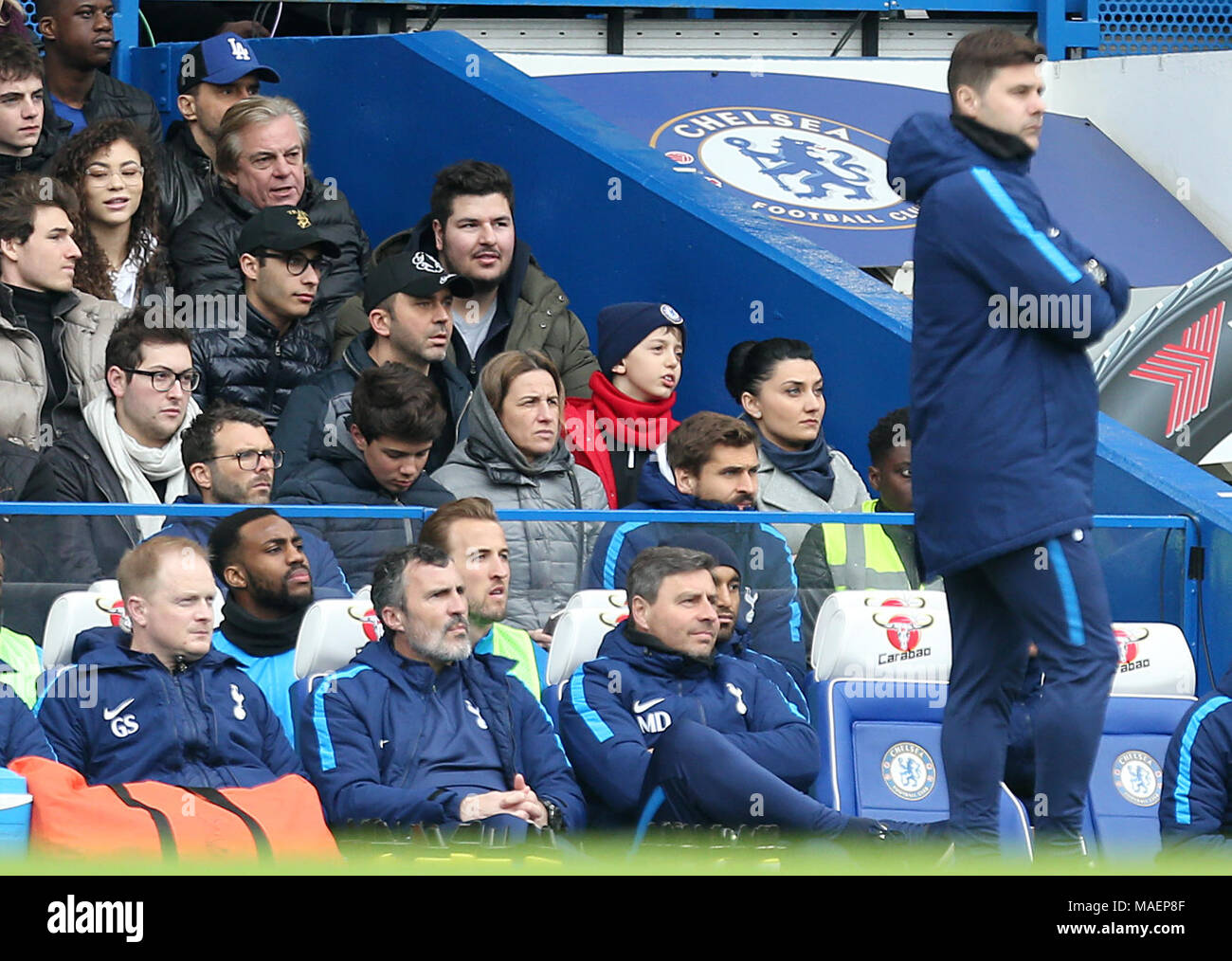 Tottenham Hotspur's Harry Kane on the bench behind manager Mauricio ...