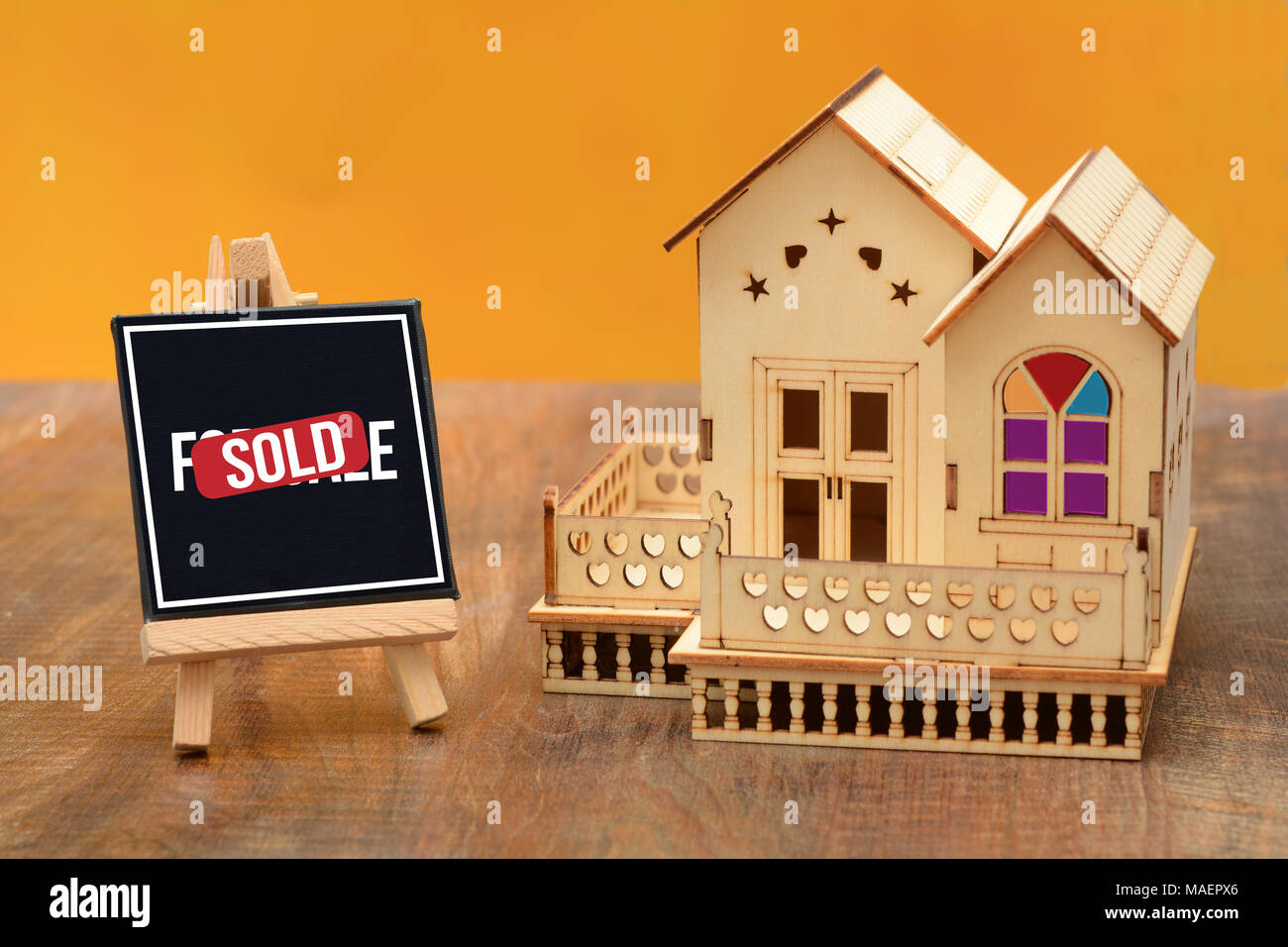 House 3D miniature with Sold chalkboard sign Stock Photo - Alamy