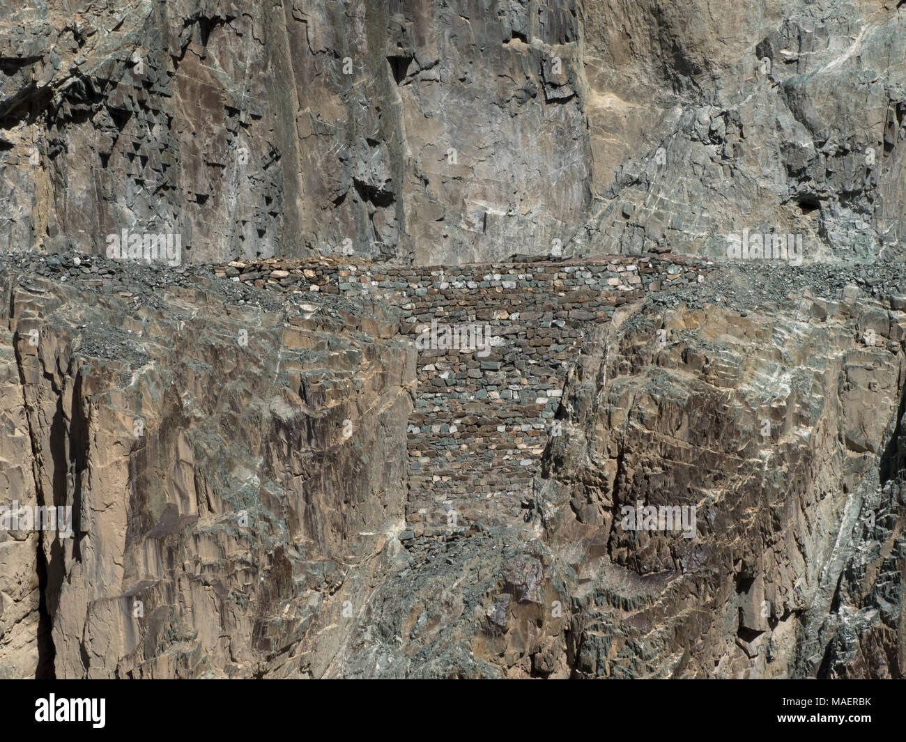 Abstract background, rough texture of a brown rock mountain rock, in ...