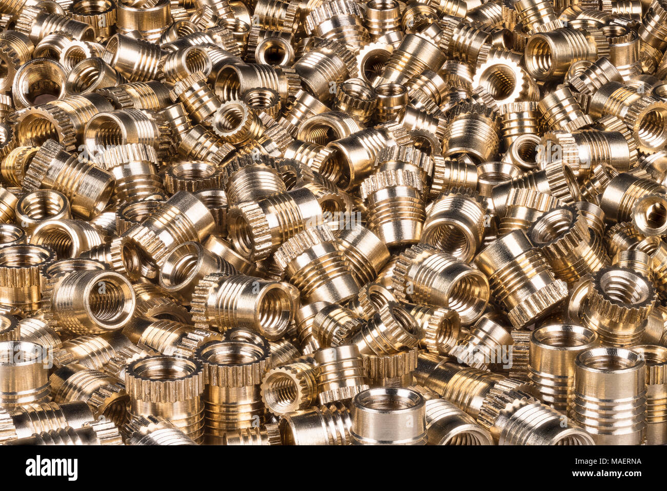 Texture of bronze threaded inserts. Close-up of decorative pile from ...