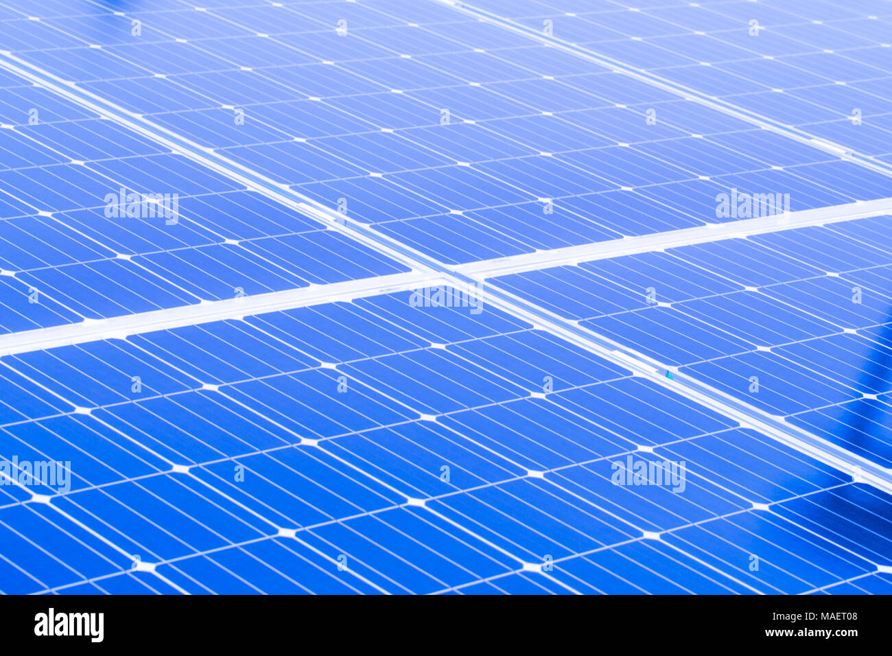 white with blue solar panels, background image Stock Photo - Alamy