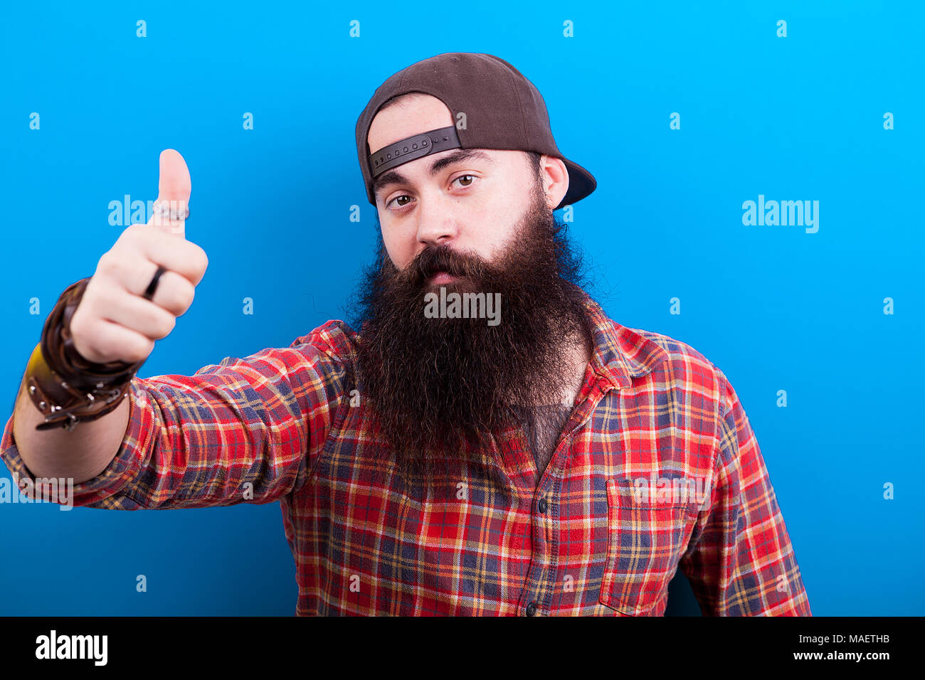 Happy long bearded man showing a thumbs up Stock Photo - Alamy
