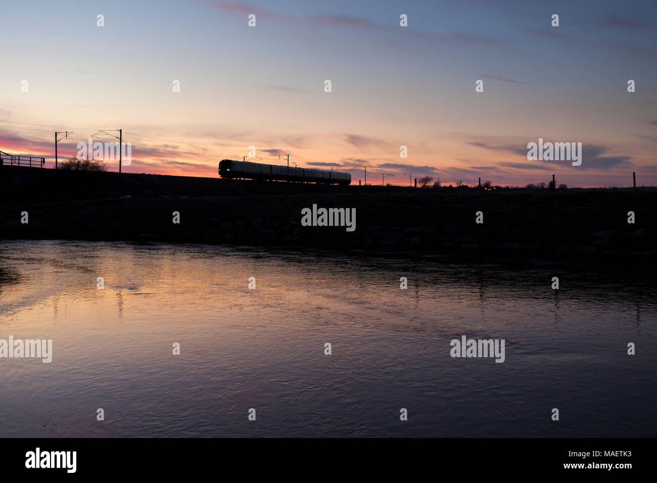A Transpennine express class 350 electric train passes Float viaduct ...