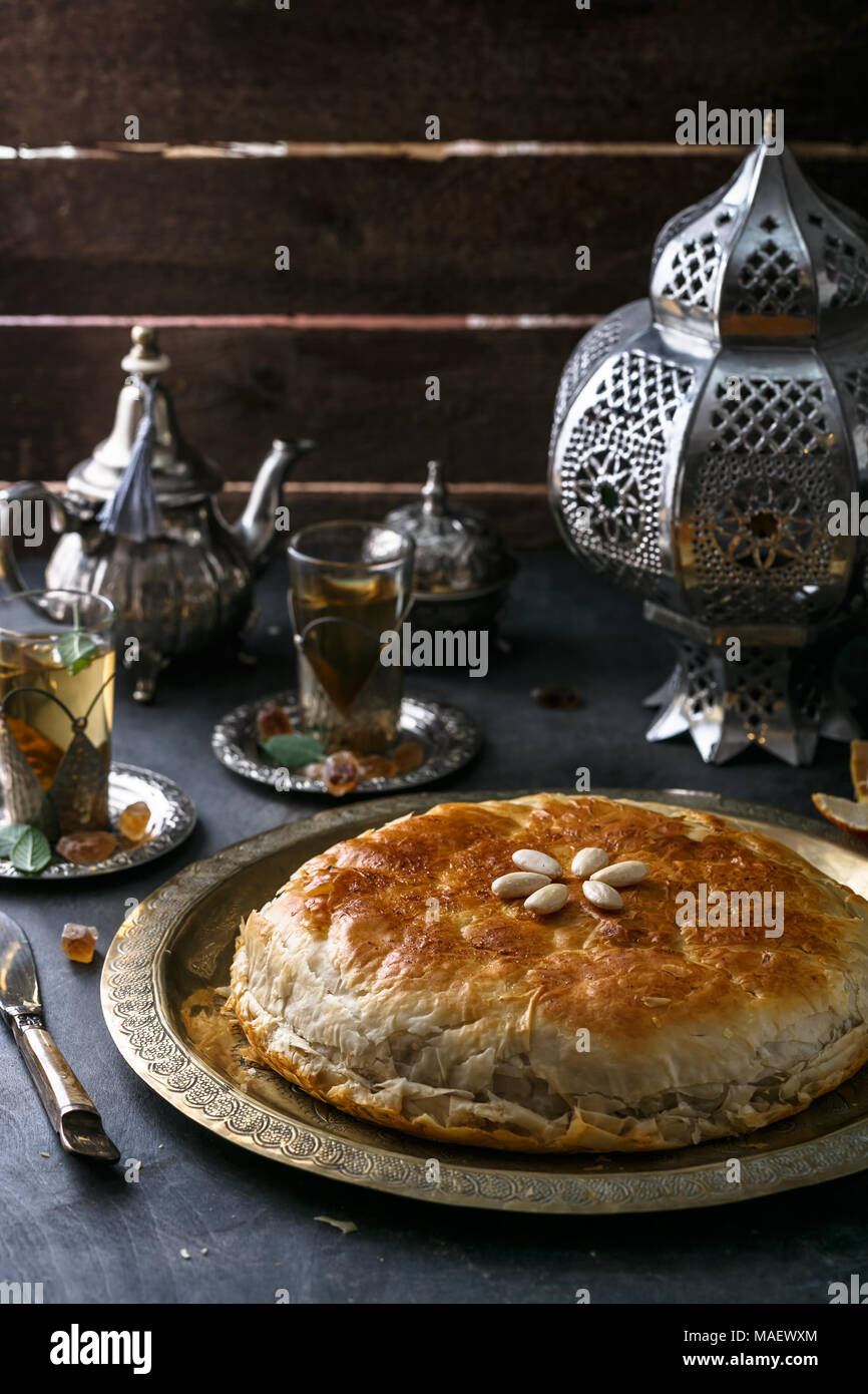 Moroccan chicken bastilla on copper plate, close view Stock Photo - Alamy
