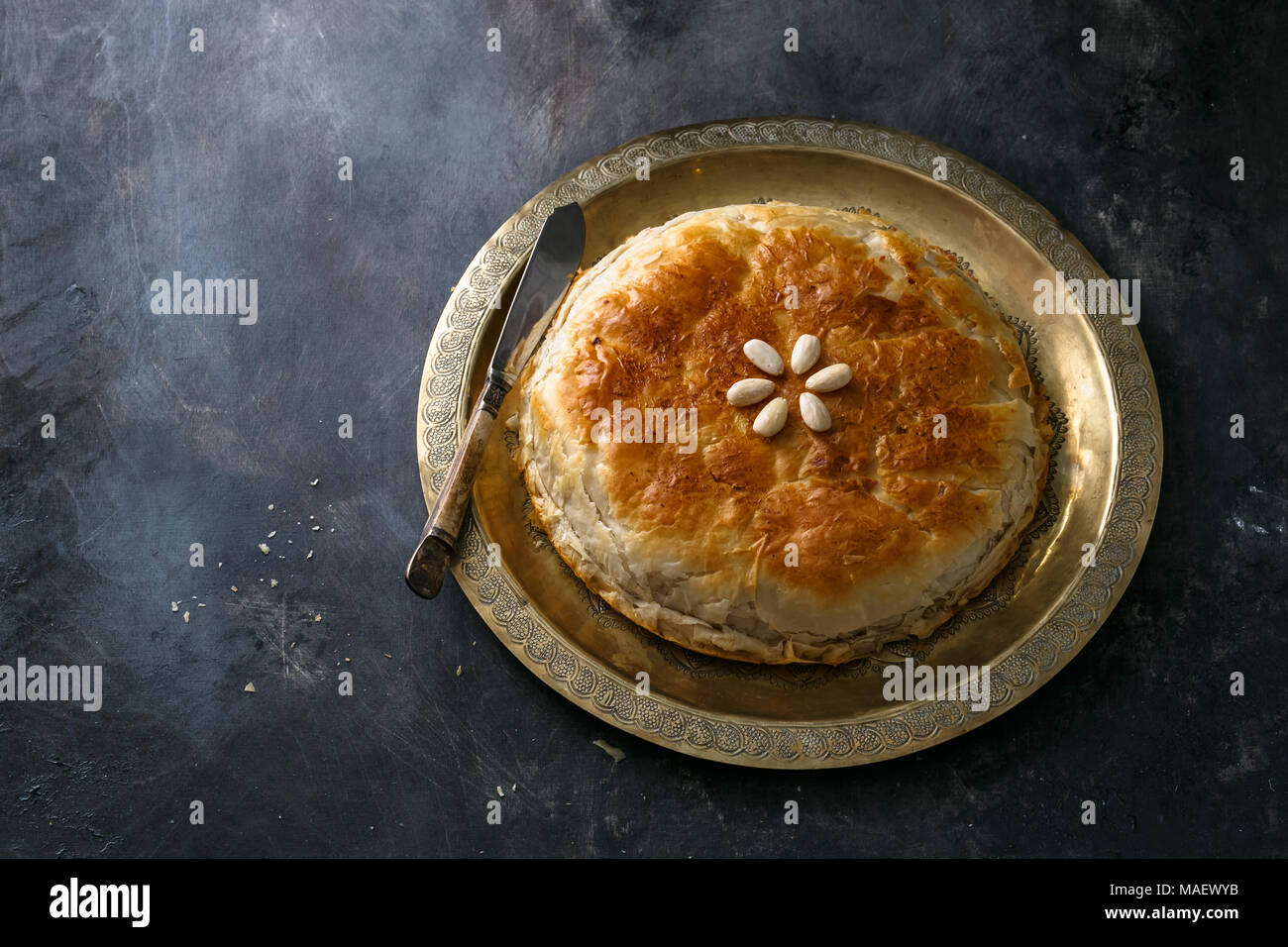 Moroccan bastilla on copper palte, space for wording Stock Photo - Alamy