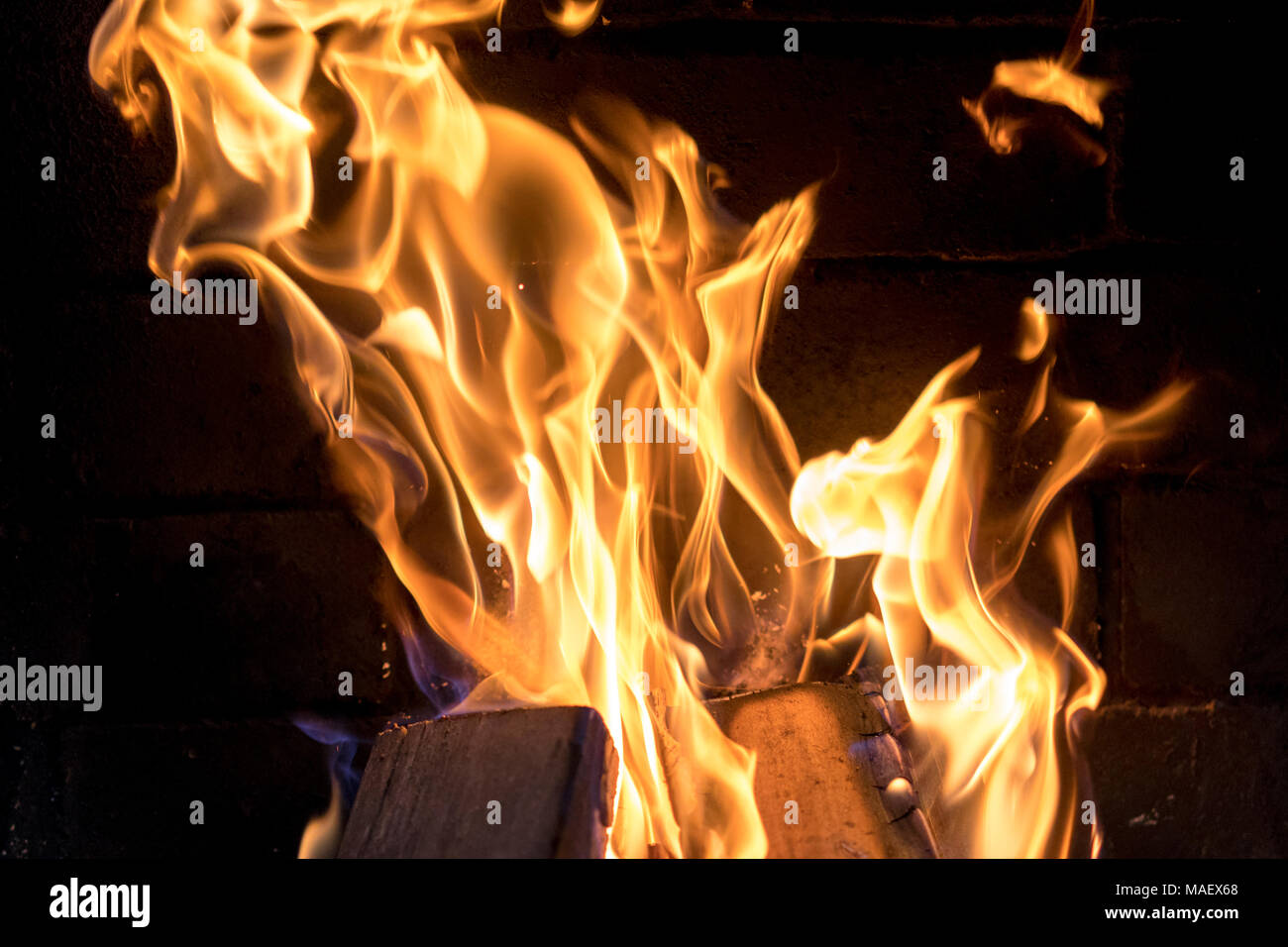 Frozen bright fire in the fireplace. Bright fire in the fireplace close ...