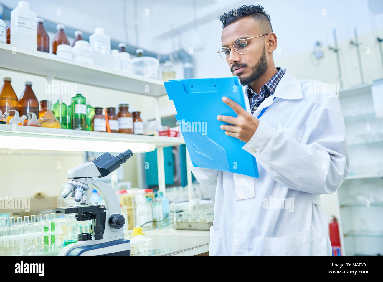 Man summarizing results of experiment in laboratory Stock Photo - Alamy
