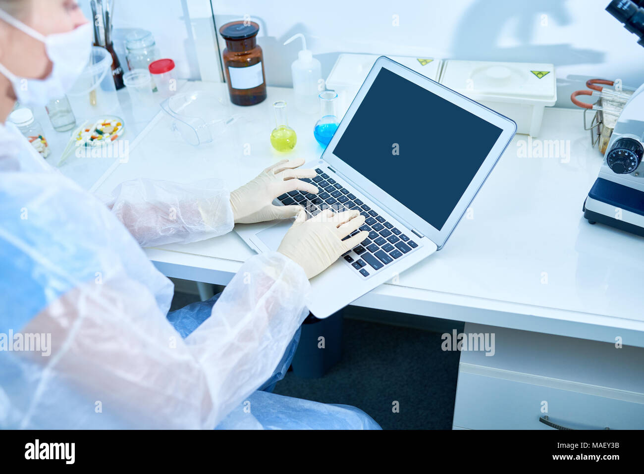 Busy researcher typing scientific article Stock Photo - Alamy