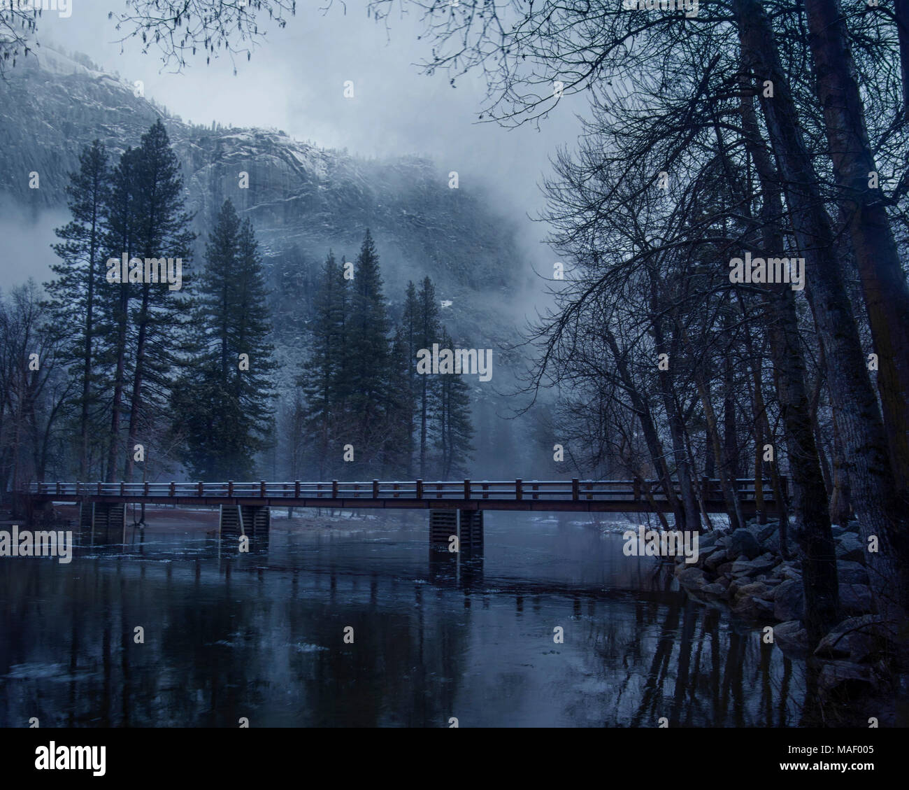 The Merced River flows through the Yosemite Valley in the early predawn ...