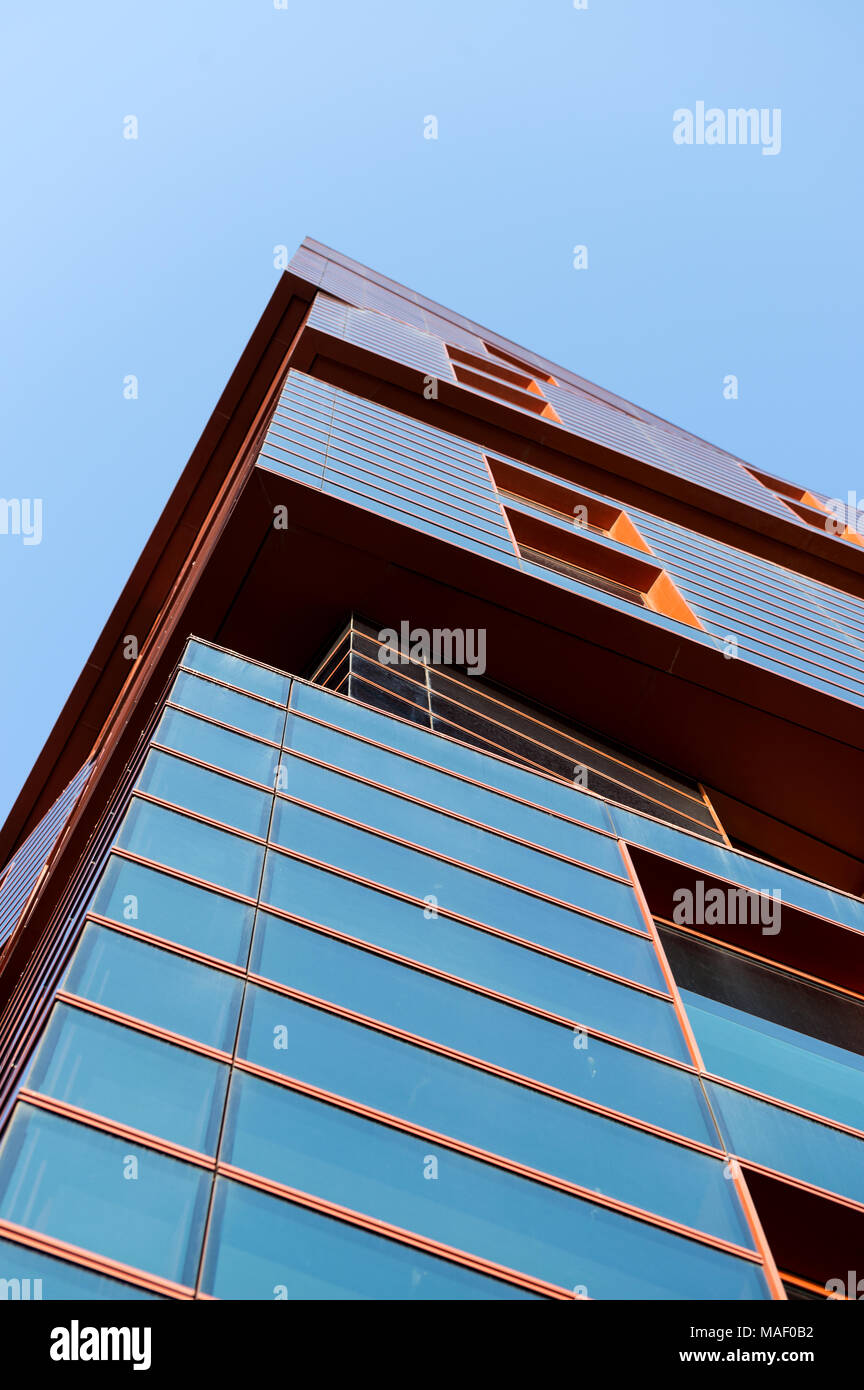 A modern building mirror facade in blue tone Stock Photo - Alamy