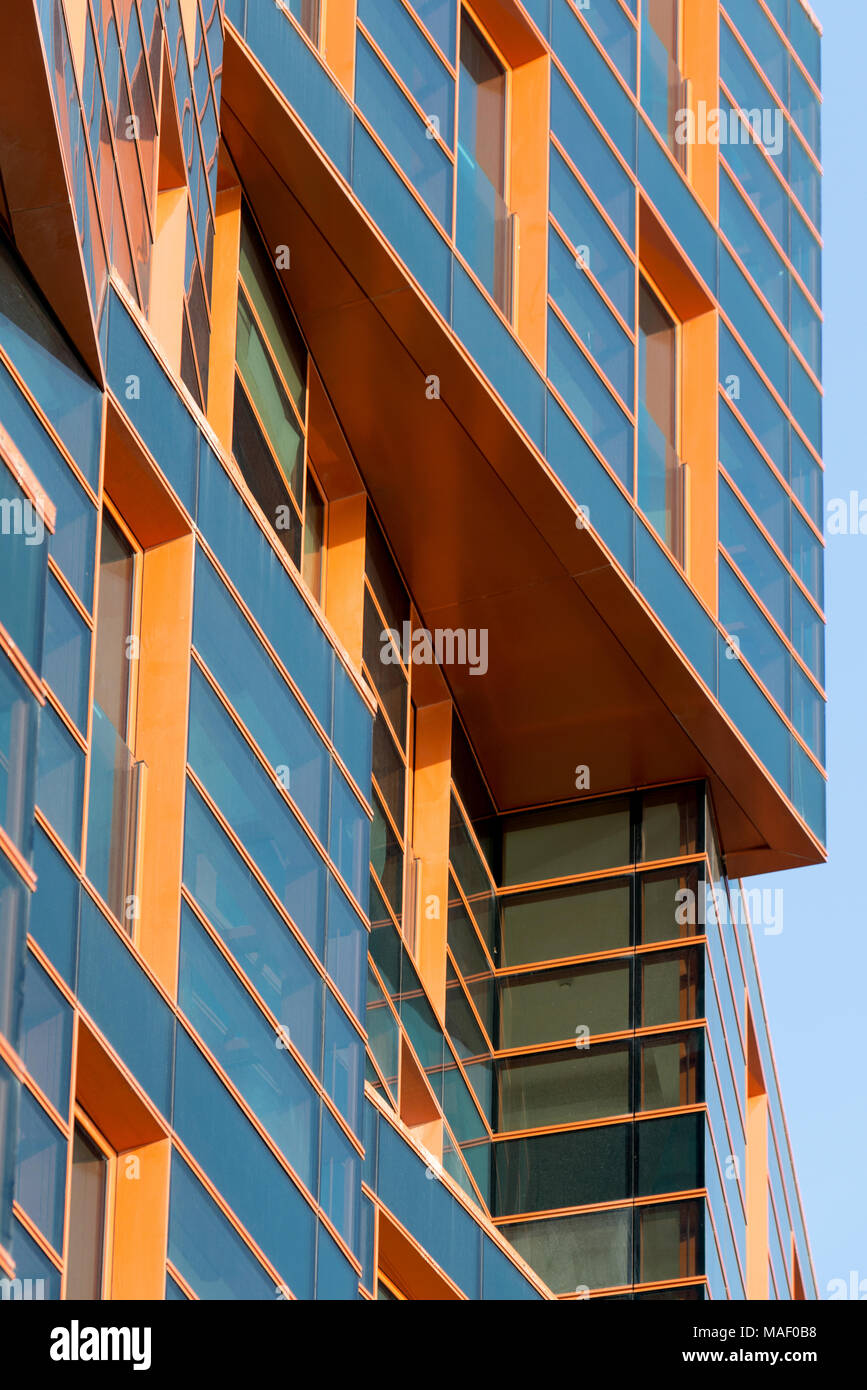 A modern building mirror facade in blue tone Stock Photo - Alamy