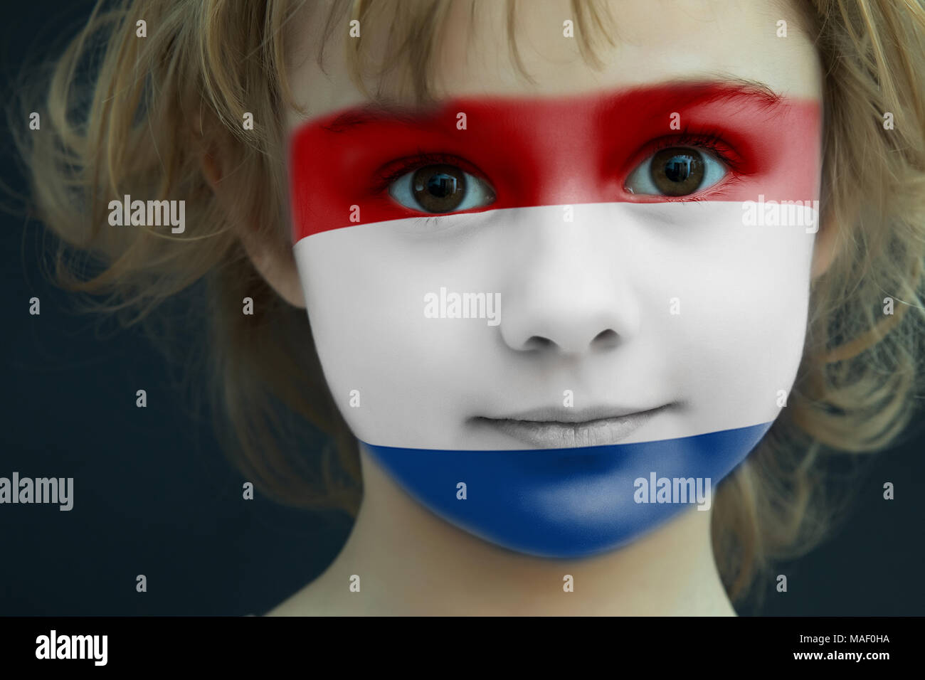 Child with a painted flag of the Netherlands Stock Photo - Alamy